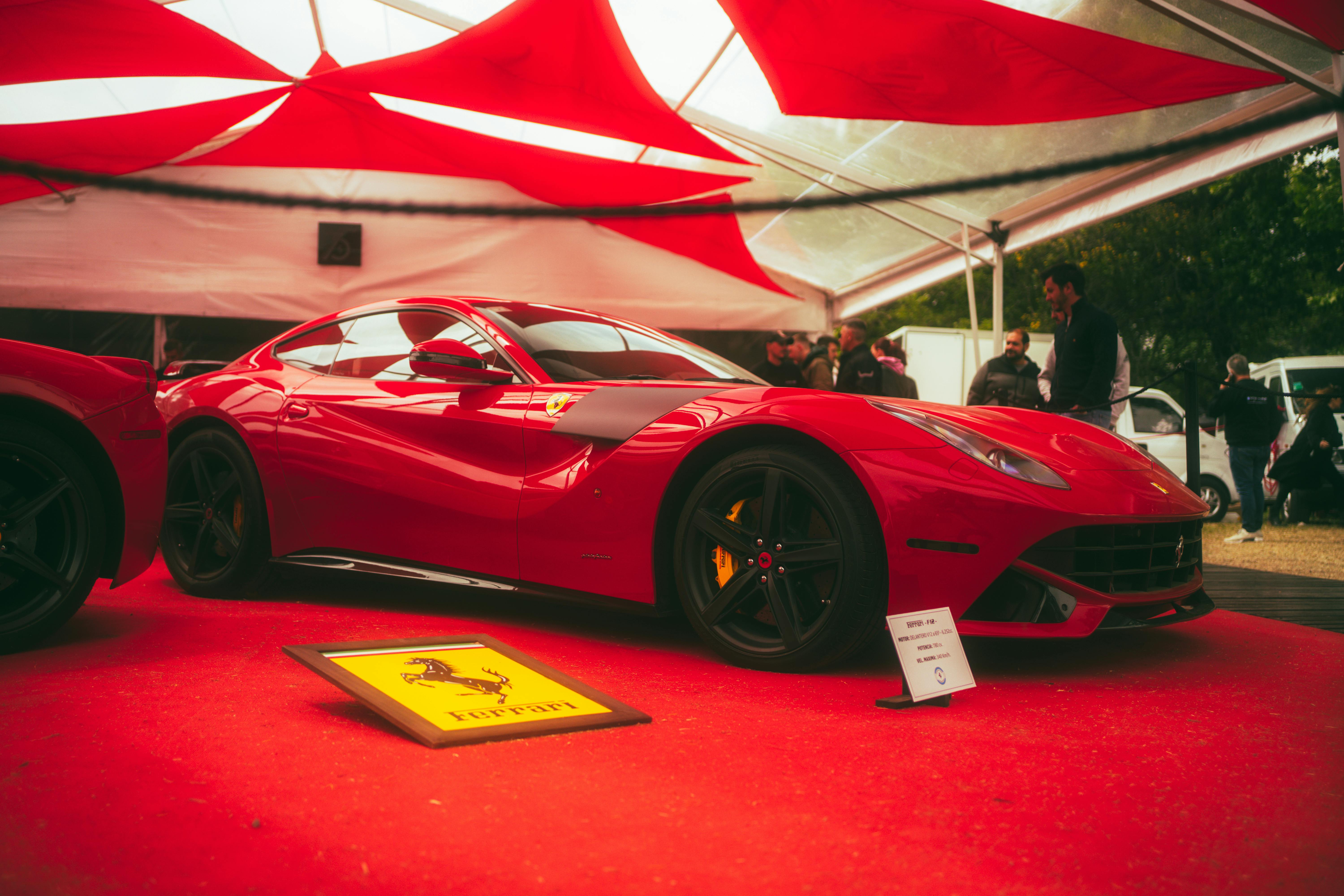 Red Ferrari on a Road · Free Stock Photo