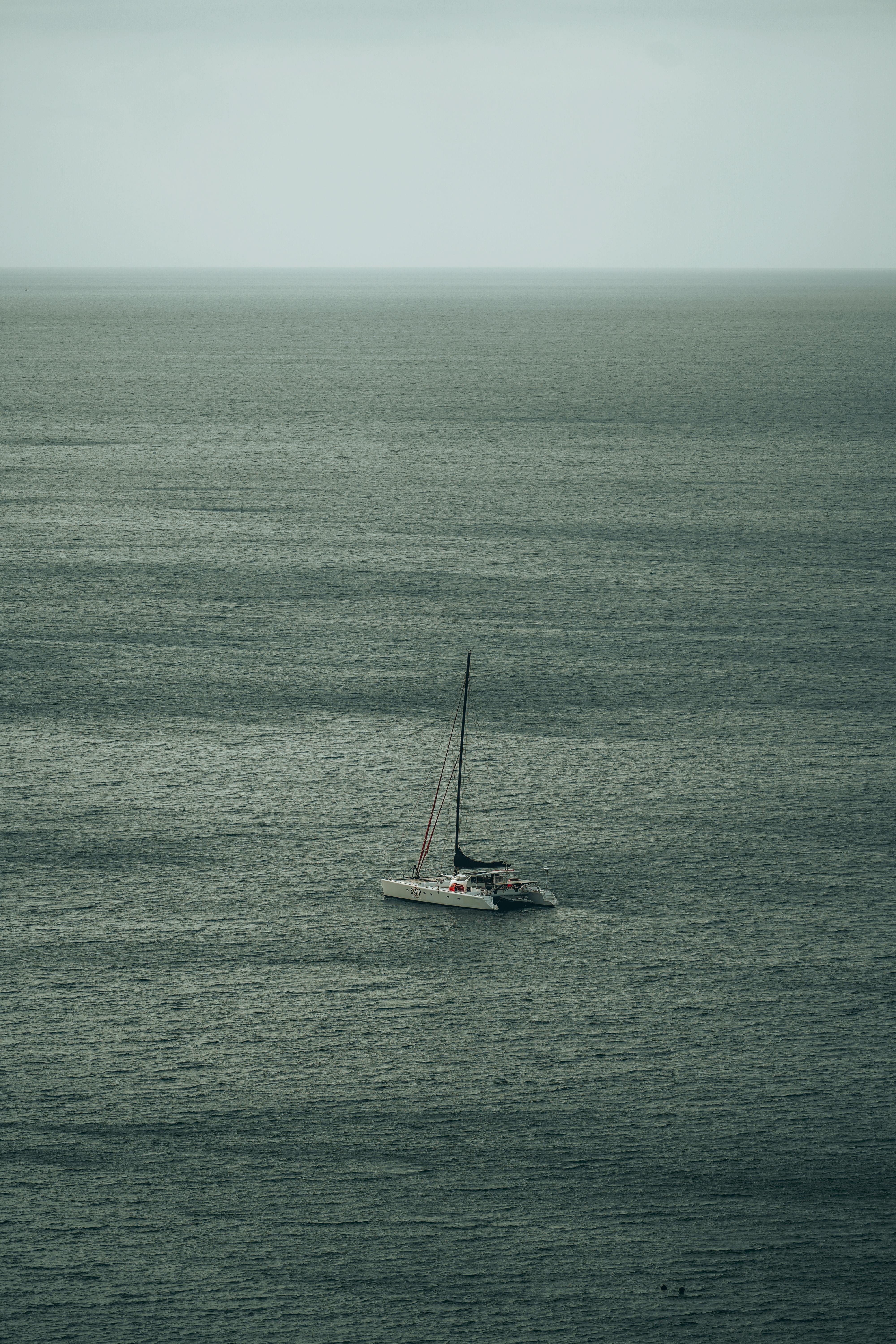 An Aerial Shot of a Boat Sailing on the Sea · Free Stock Photo