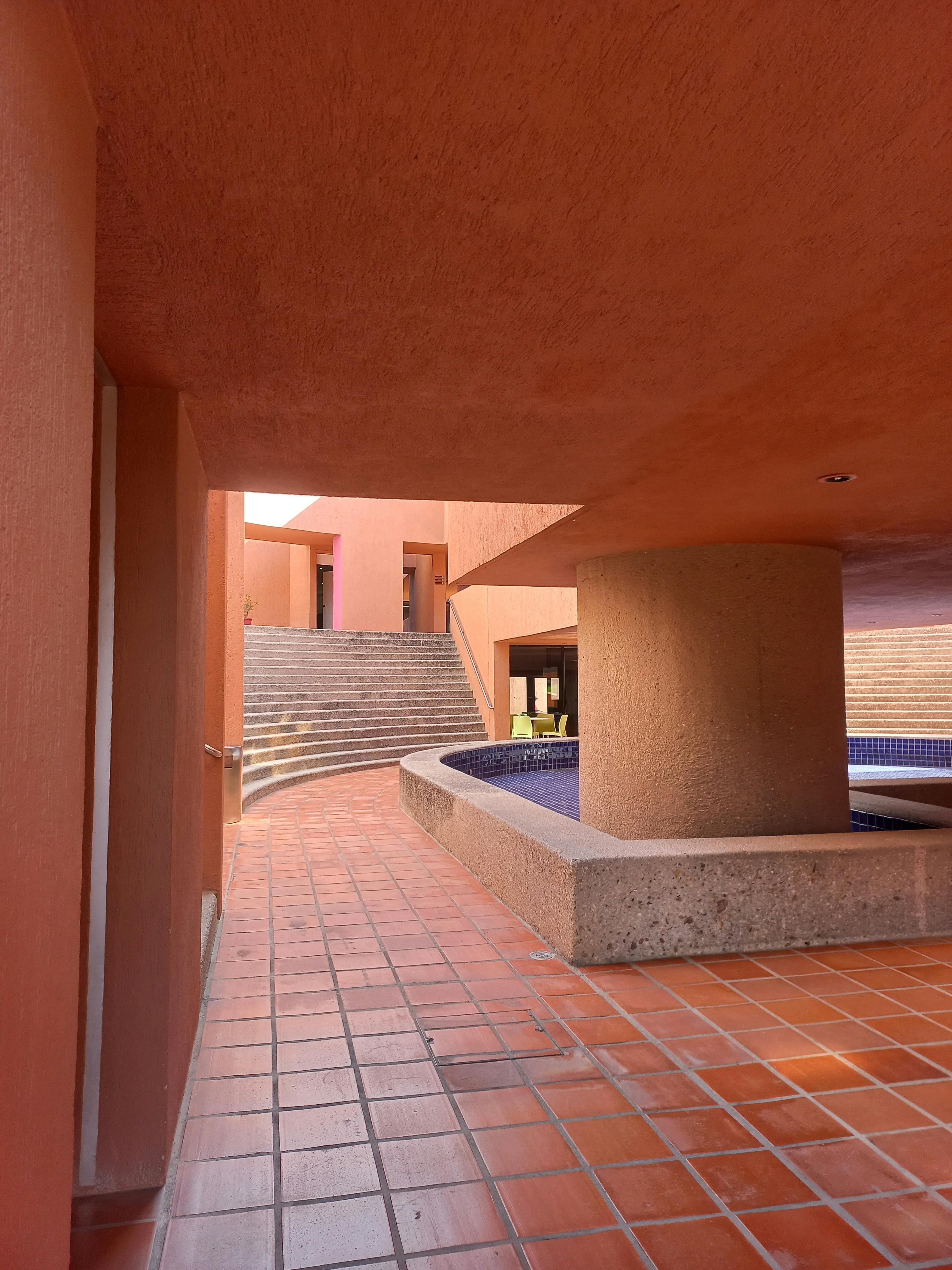 Pavement under Building Pillar · Free Stock Photo