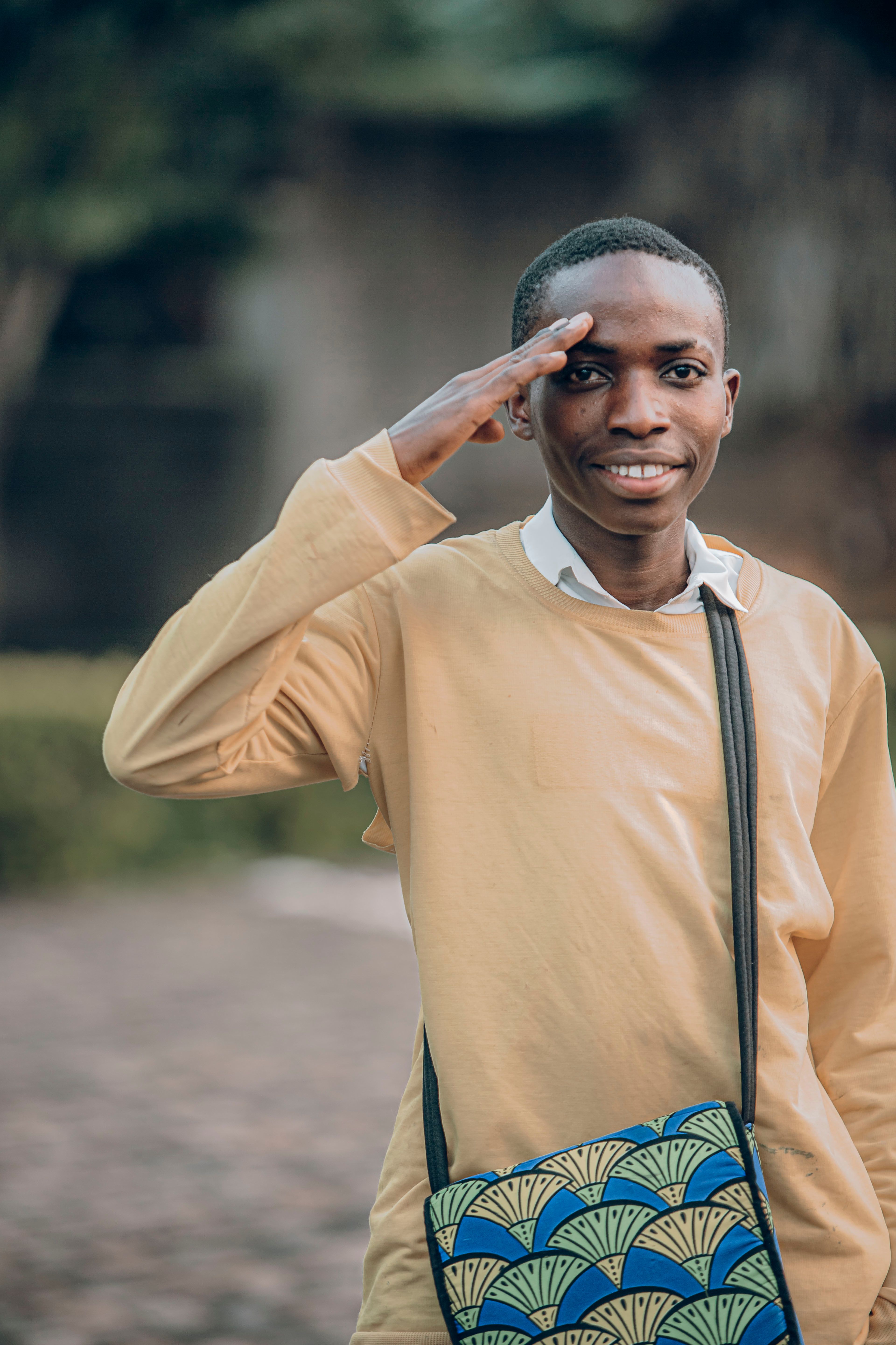 Portrait of Smiling Man Saluting · Free Stock Photo