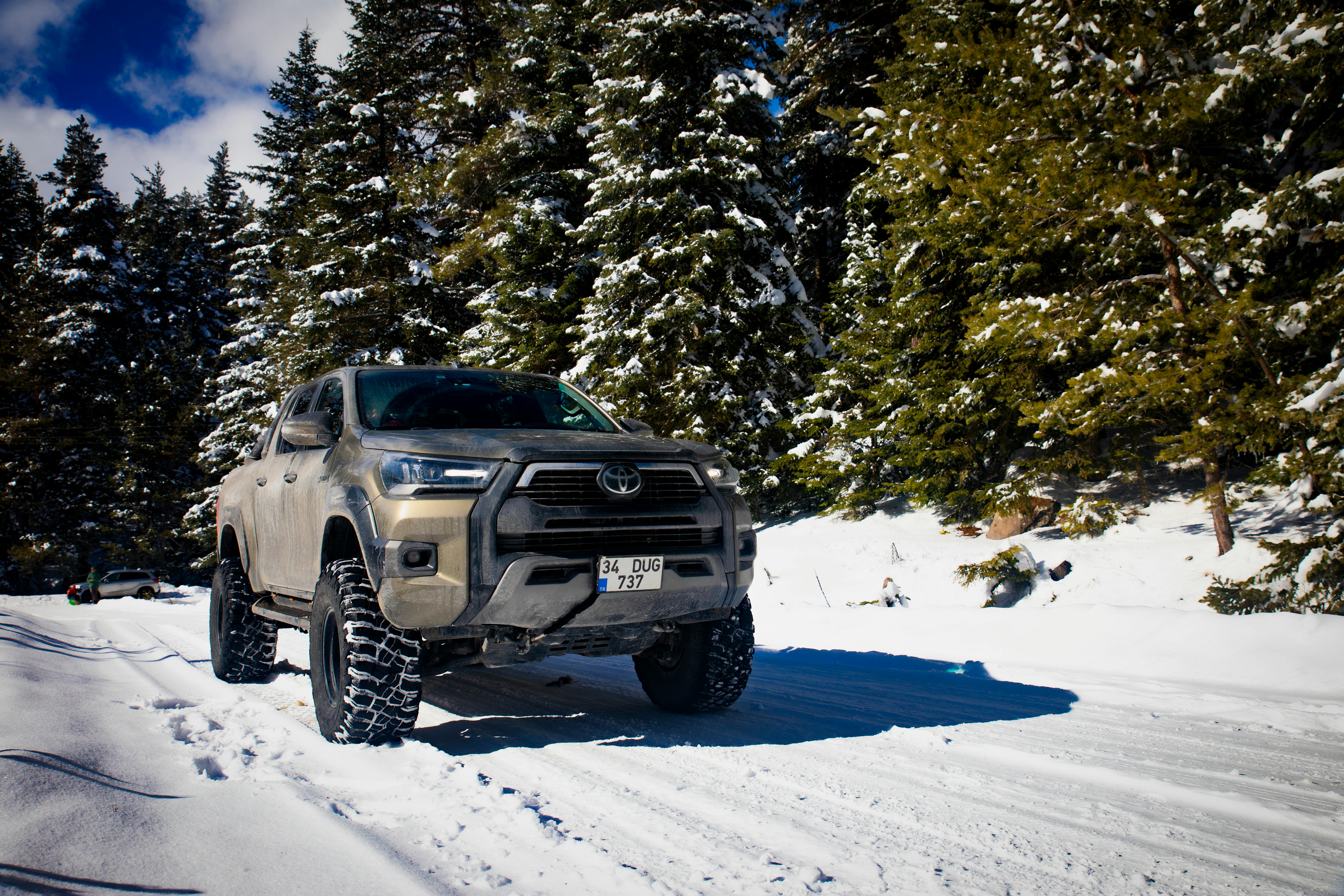Toyota Hilux in Forest in Winter · Free Stock Photo