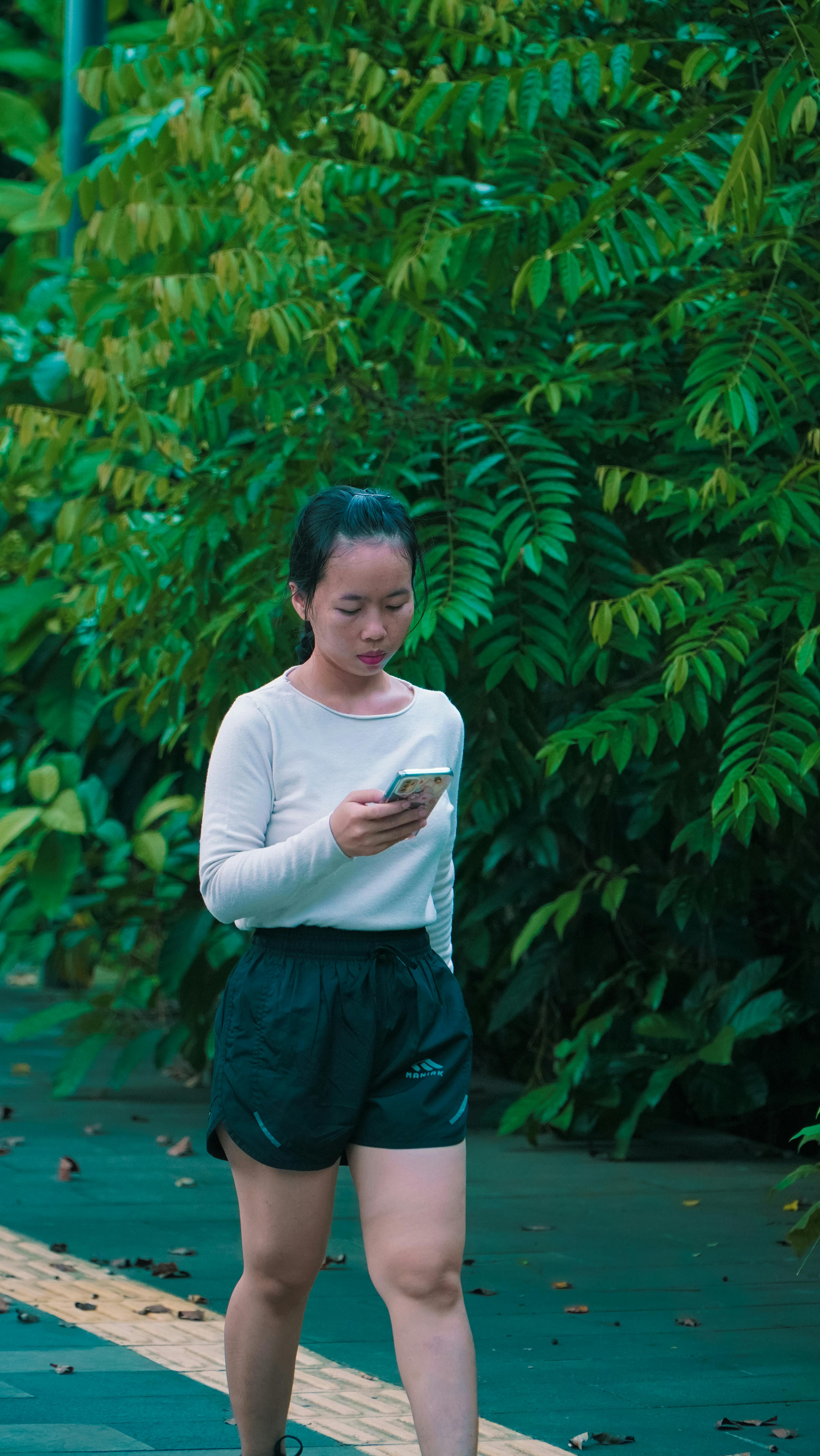 Woman Walking with Smartphone · Free Stock Photo