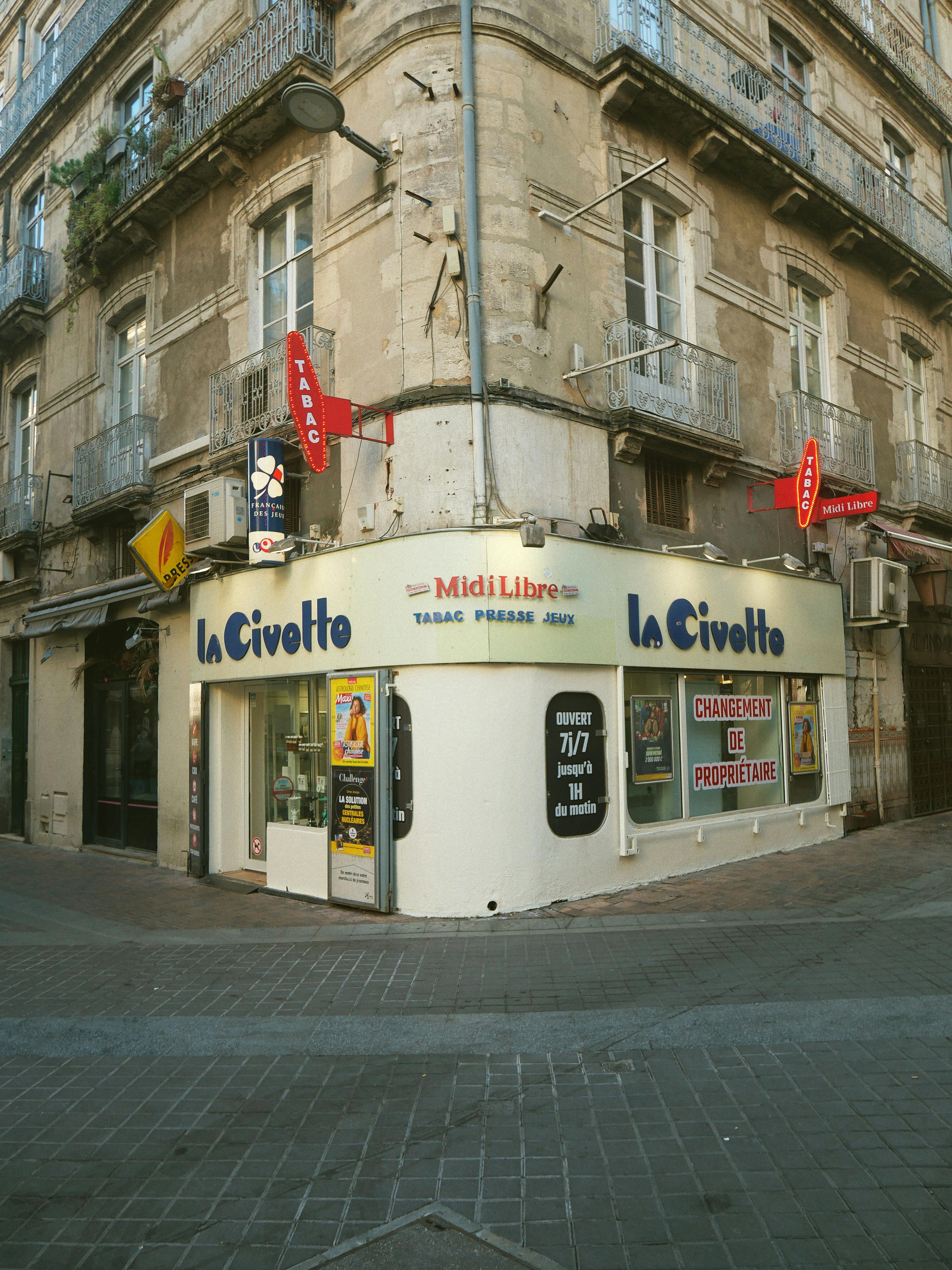 Store on Street Corner in City in France · Free Stock Photo