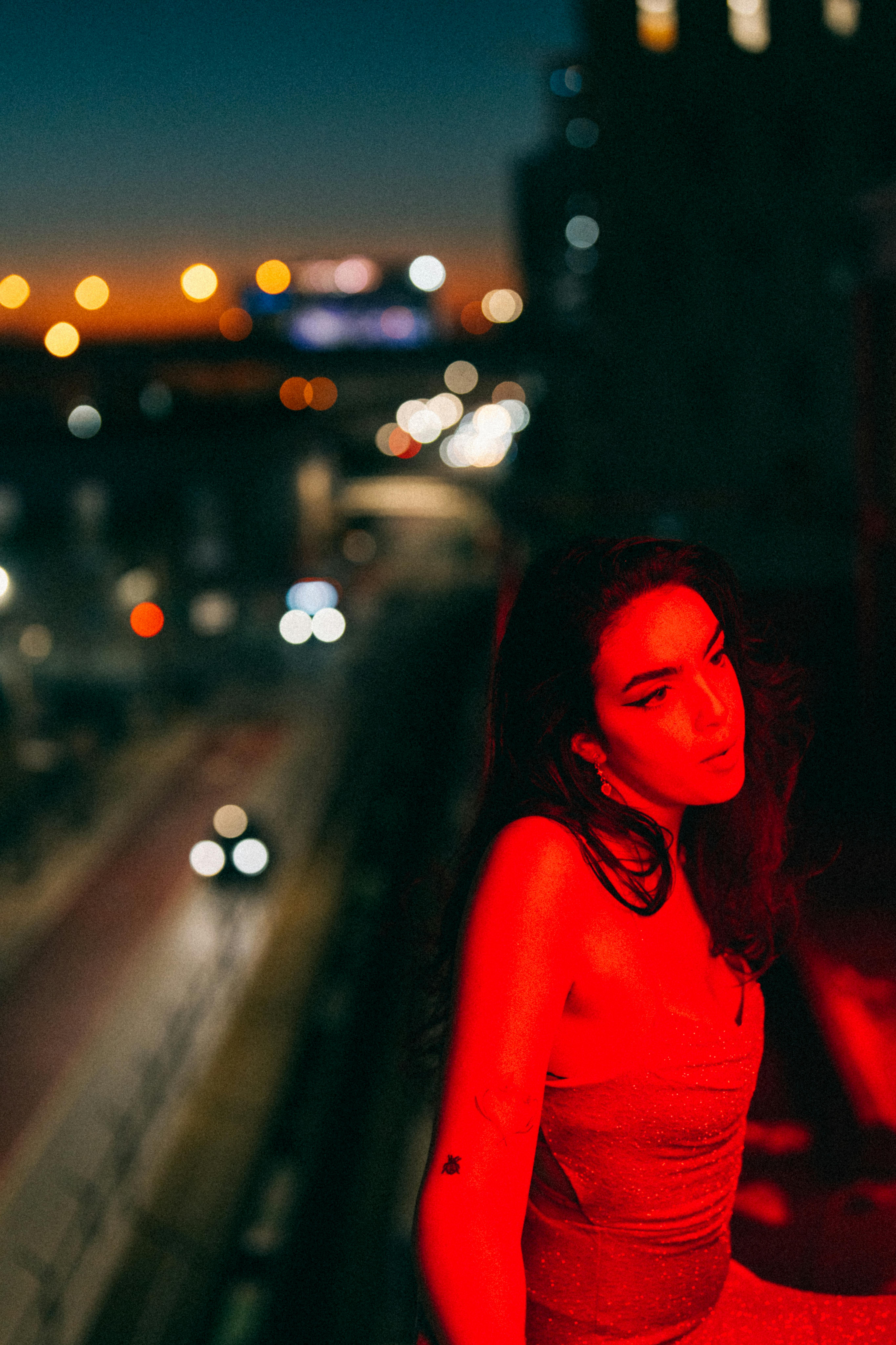 Woman Sitting in Red Light · Free Stock Photo