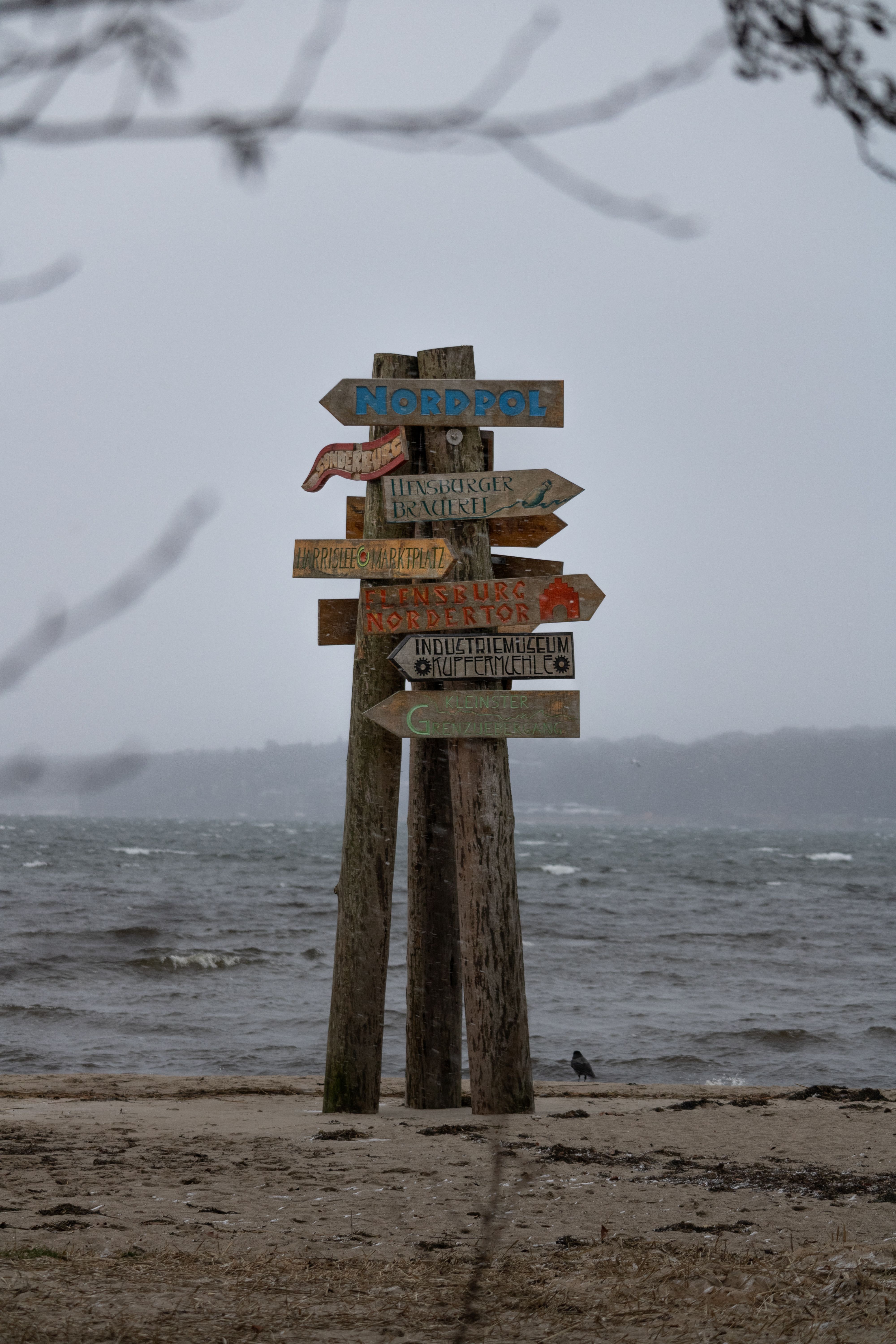 Pole with Direction Sign on Beach · Free Stock Photo