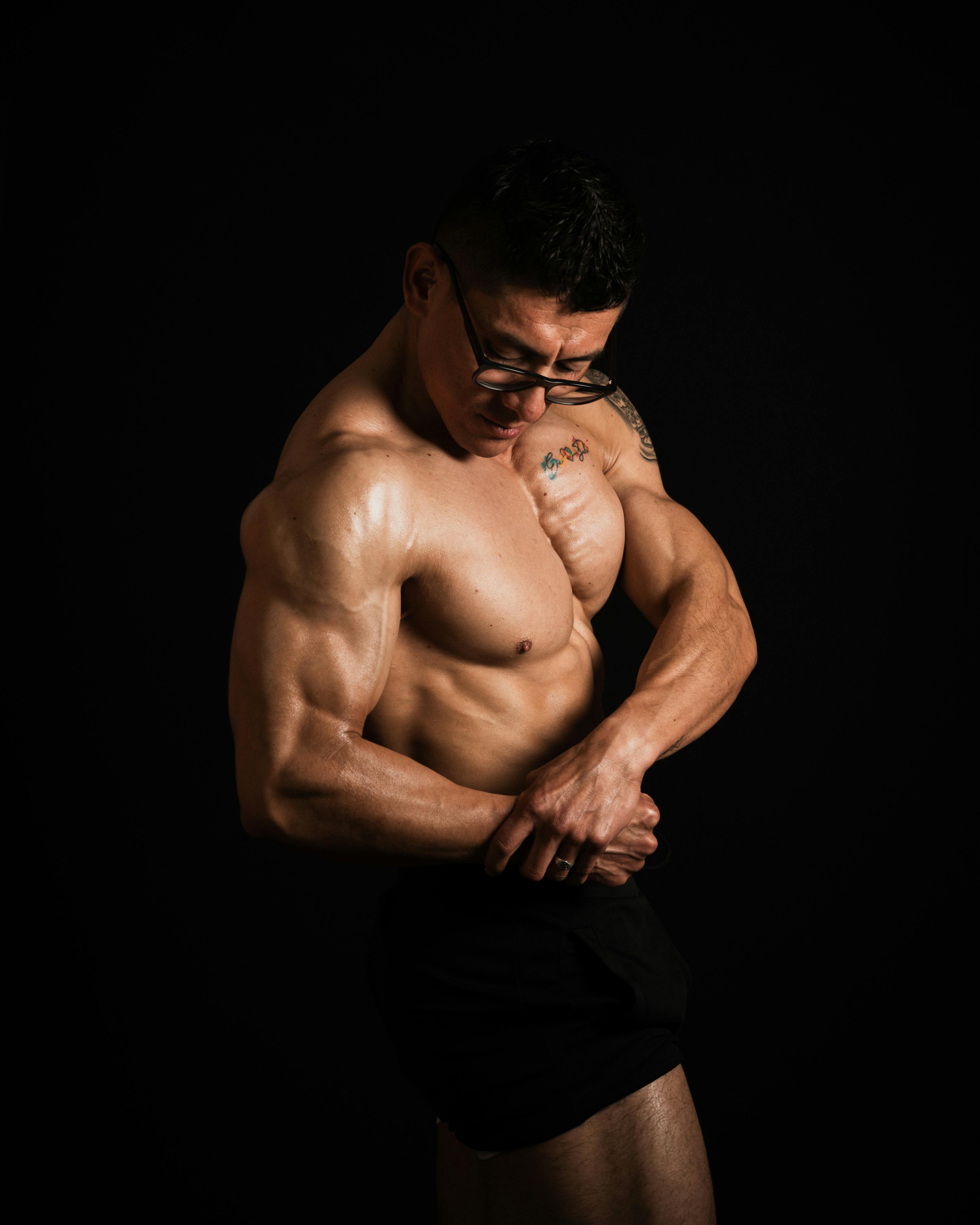 A Man Flexing His Muscles · Free Stock Photo