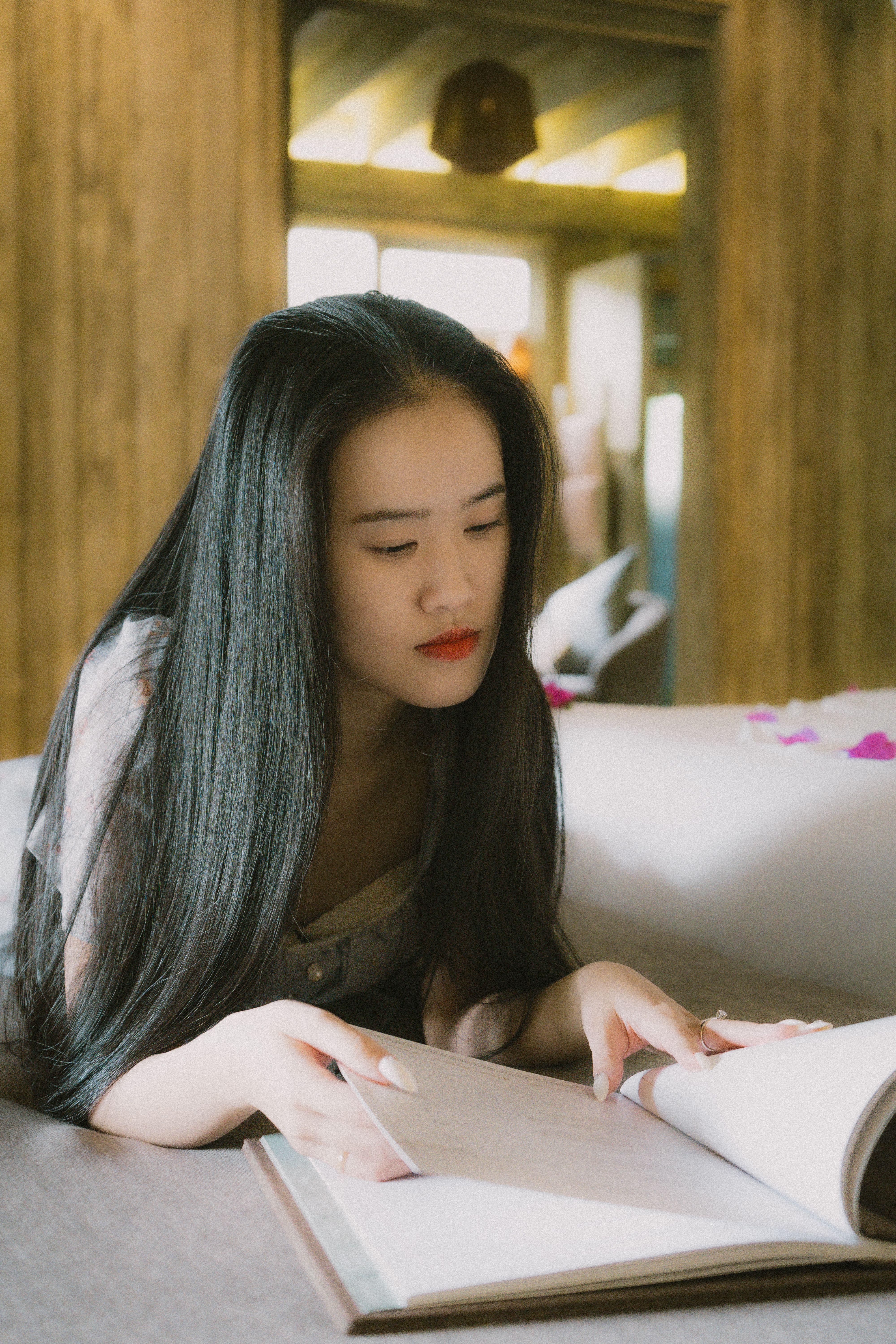 Lady Reading a Book in a Library · Free Stock Photo