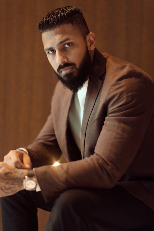 Portrait of an Elegant Man Wearing Brown Suit · Free Stock Photo Portrait of an Elegant Man Wearing Brown Suit · Free Stock Photo