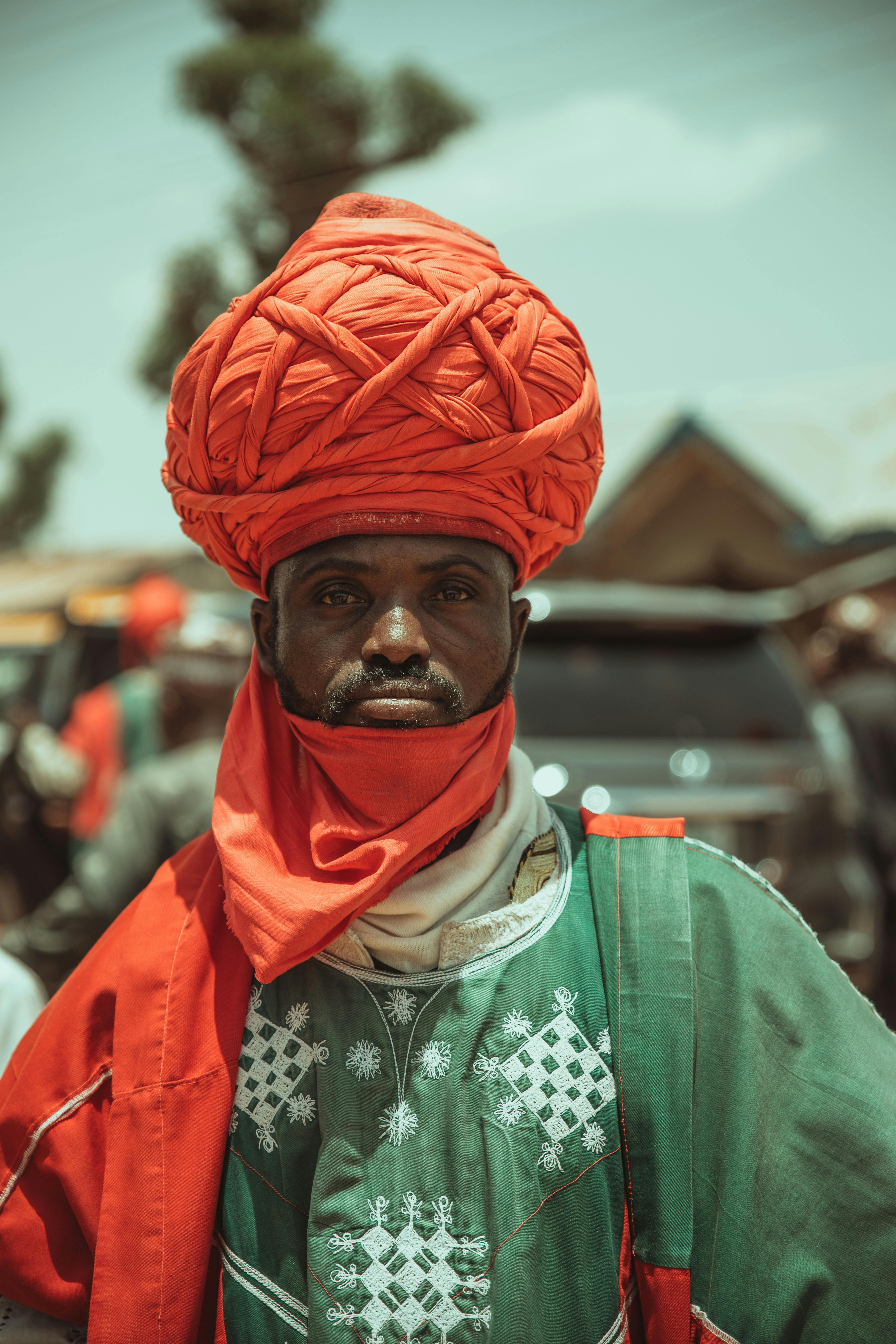 A Man Wearing Traditional Clothing and a Large Turban Standing Outside ...