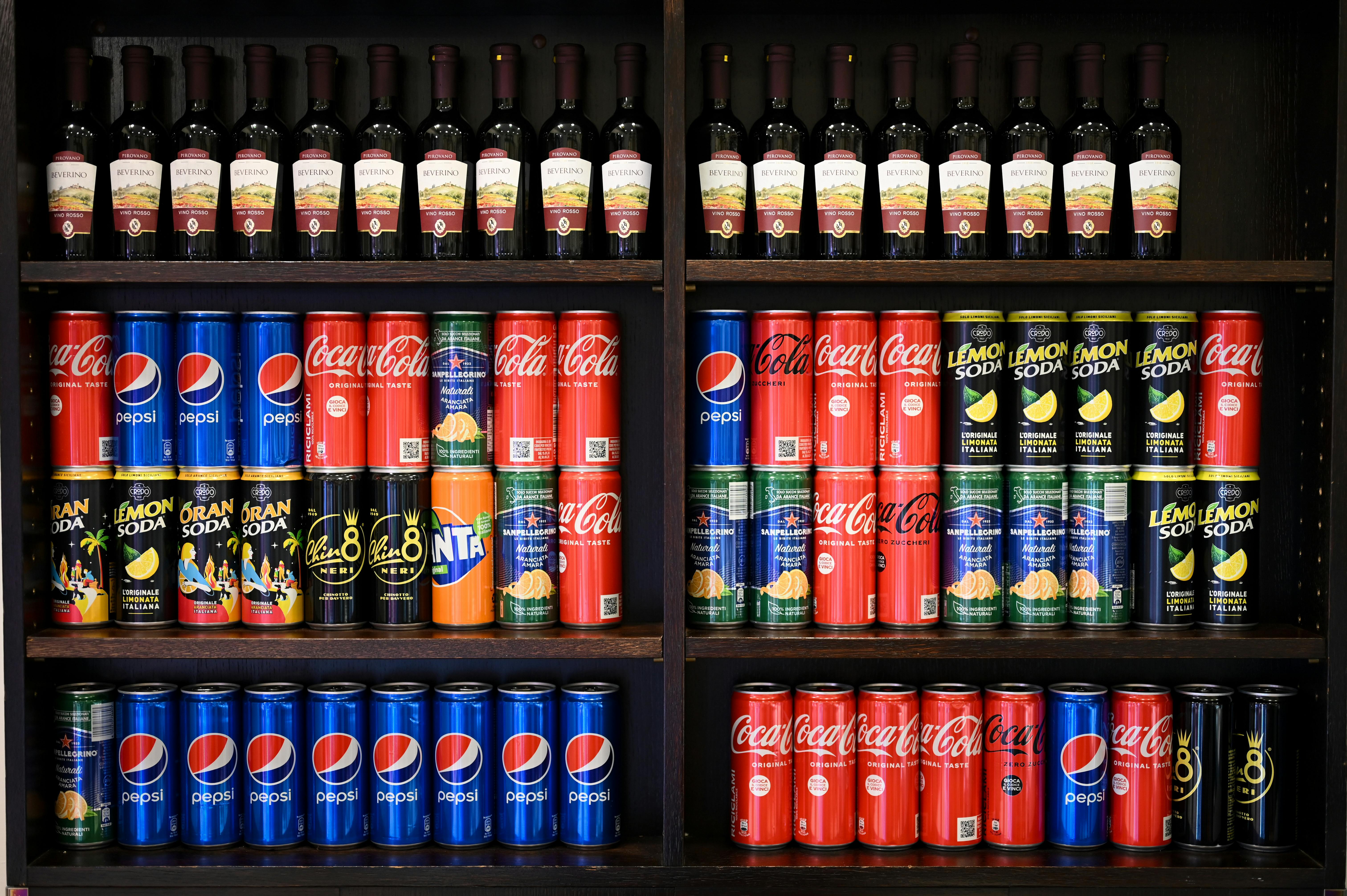 Cans of Soda Standing on the Shelves · Free Stock Photo
