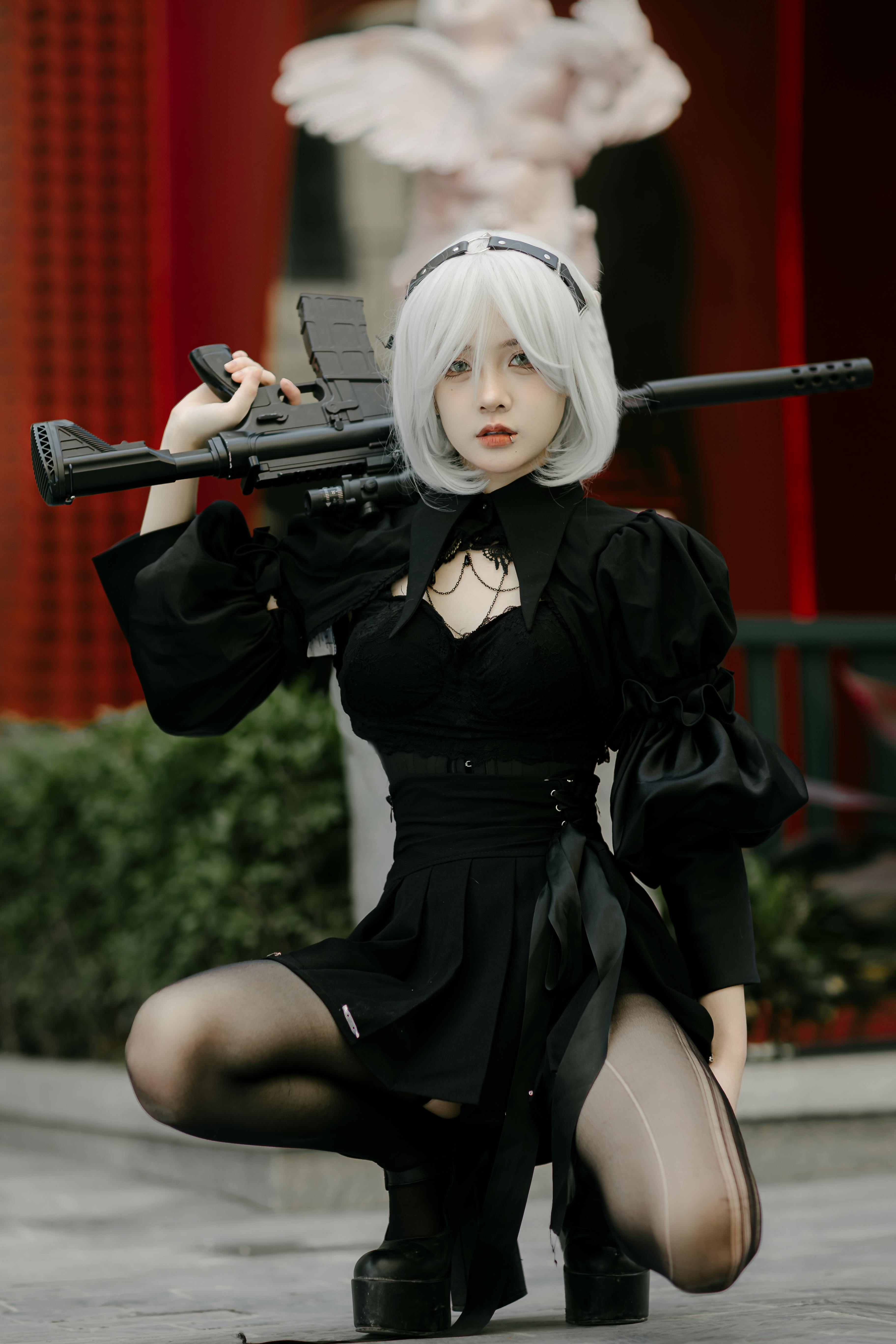 Portrait of a Female Cosplayer Posing with an Assault Rifle · Free ...