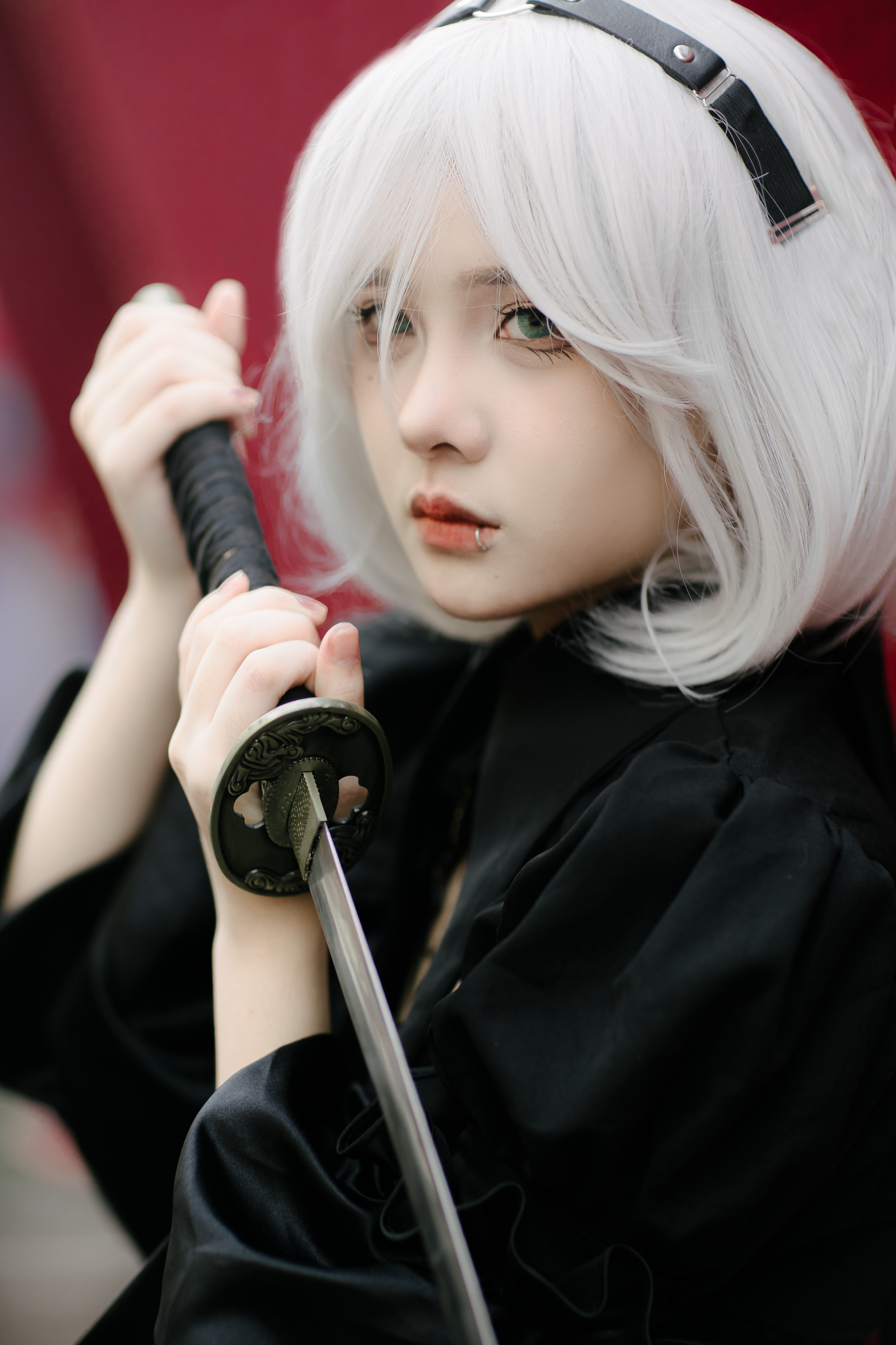 Portrait of a Female Cosplayer Posing with a Katana in Hands · Free ...
