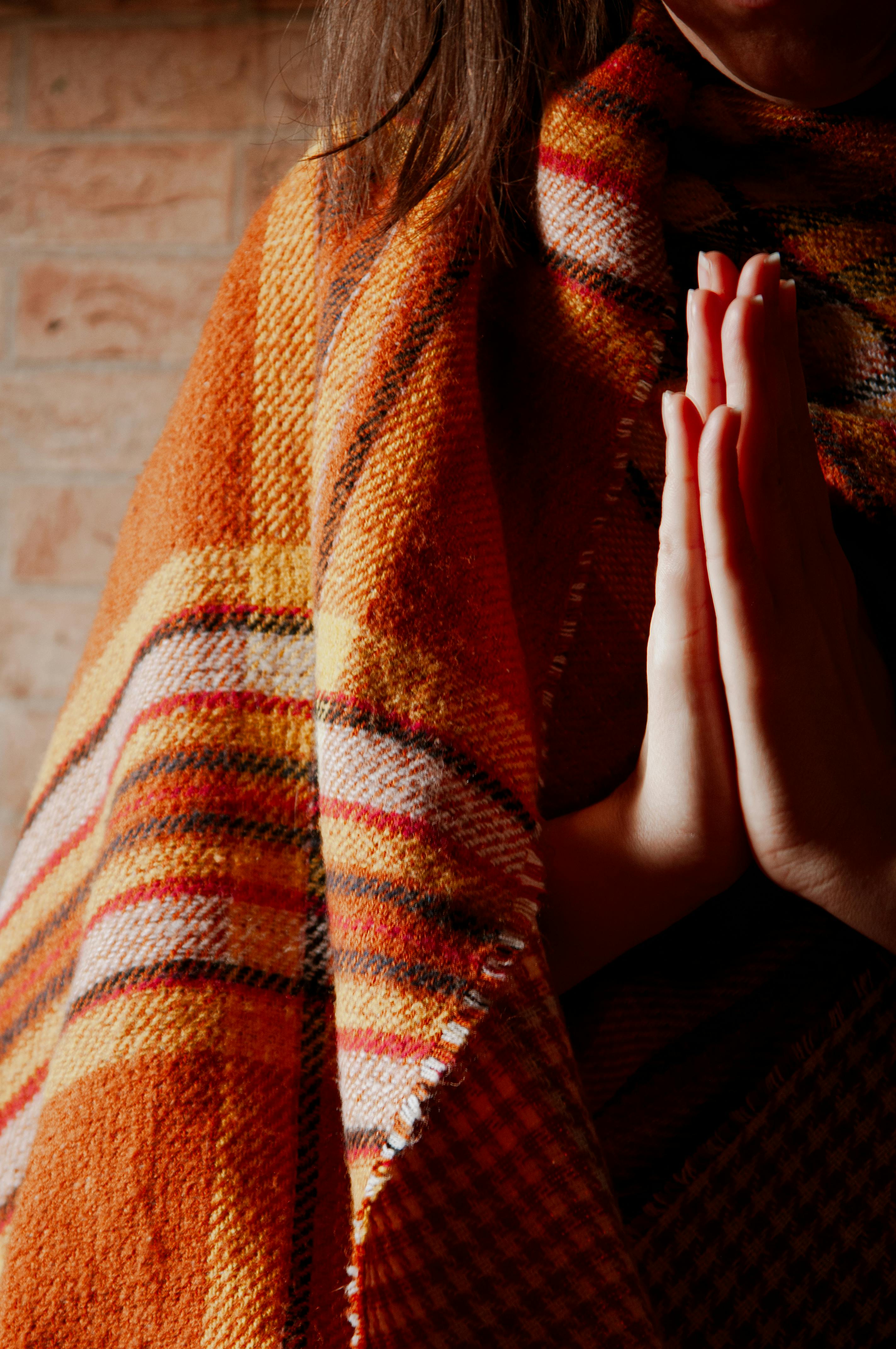 Close-up of Woman with a Blanket Thrown over Her Shoulders Standing ...