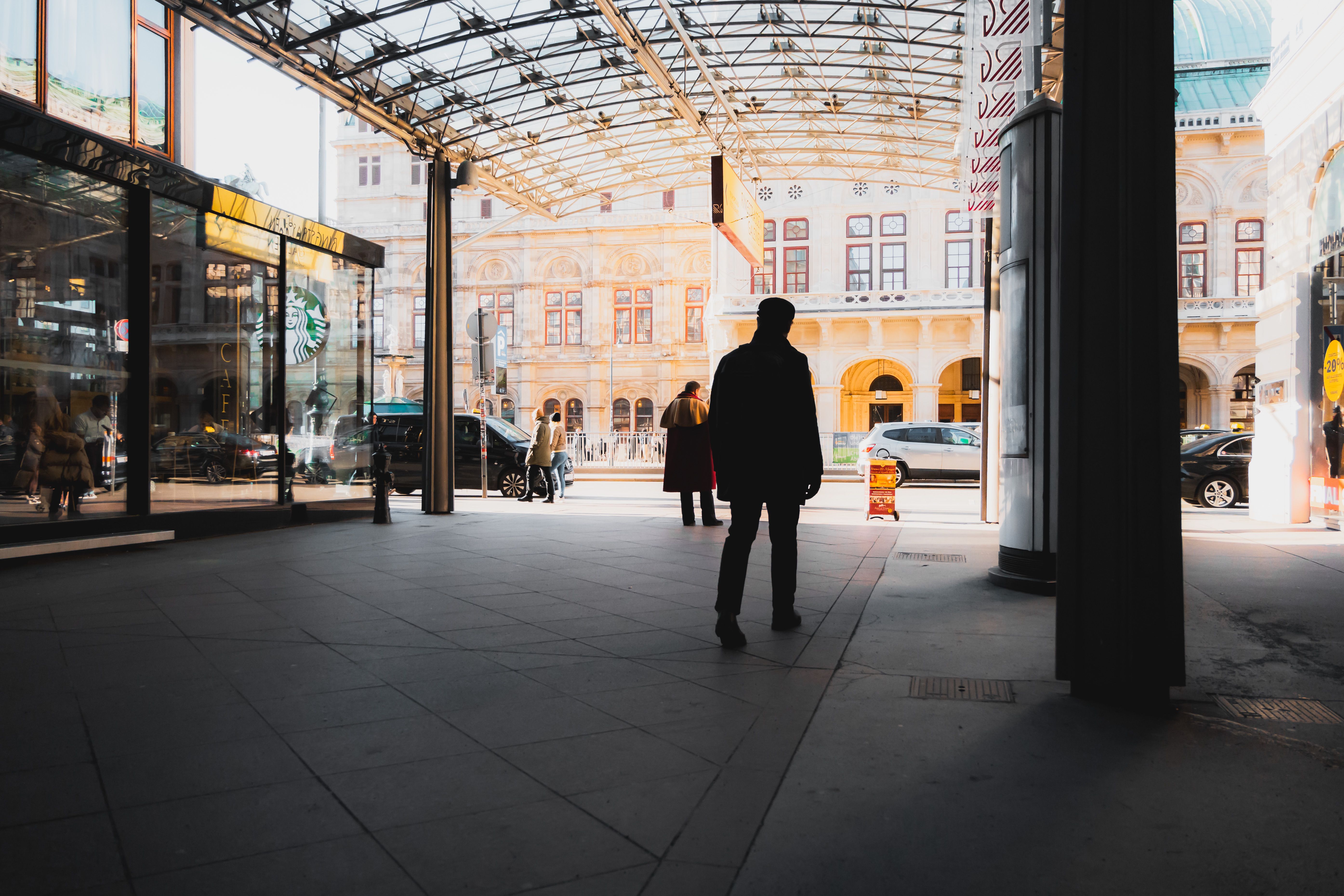 Man Walking near Store in City · Free Stock Photo