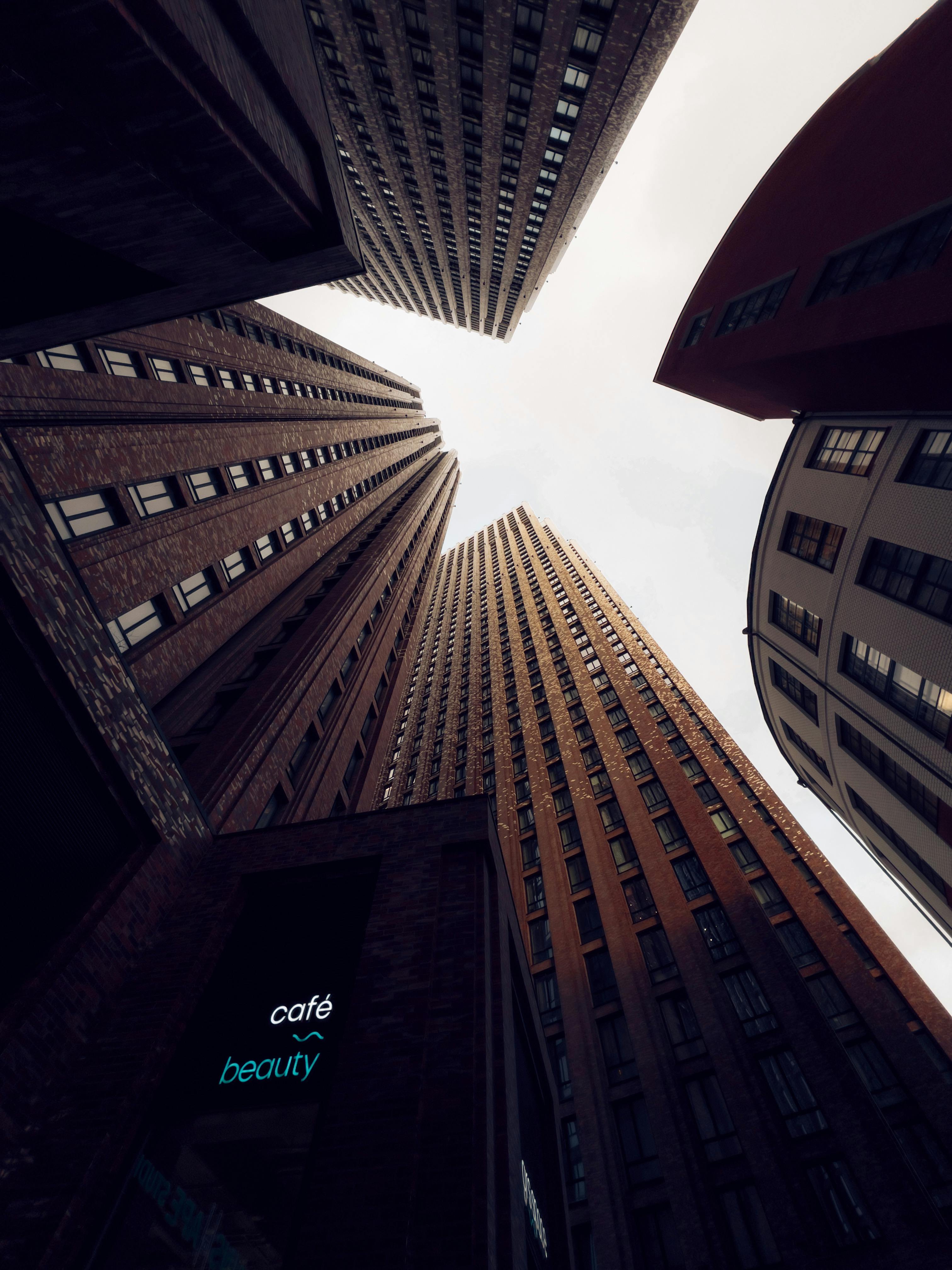 A view of tall buildings from below · Free Stock Photo