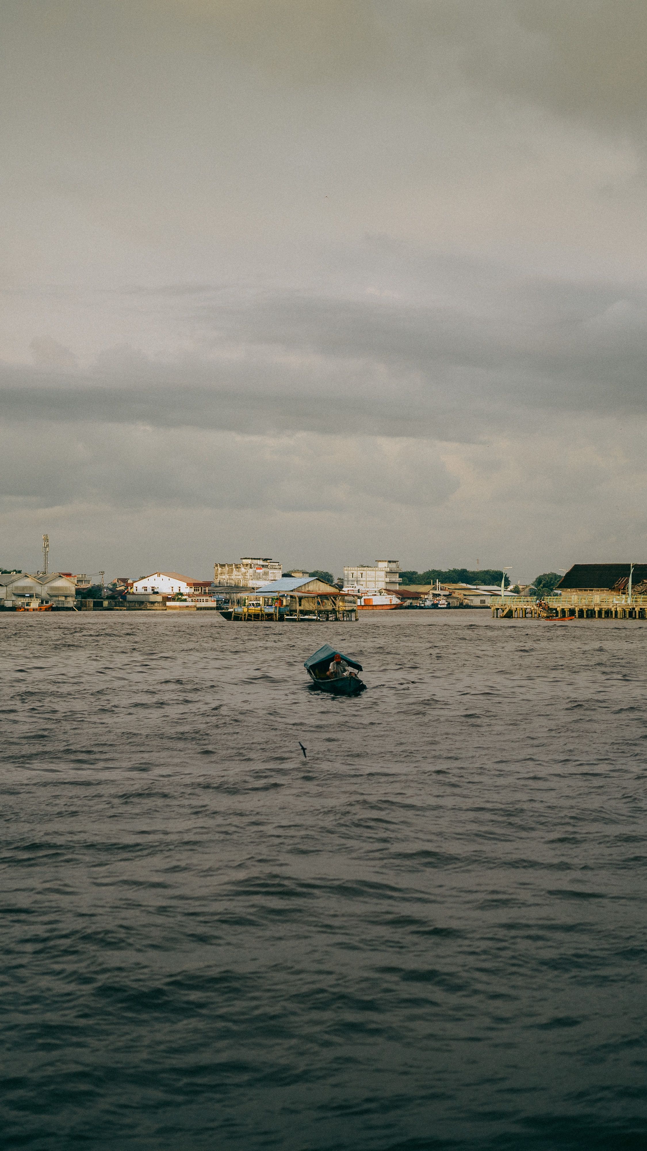 Boat on Ship on Coast in City behind · Free Stock Photo