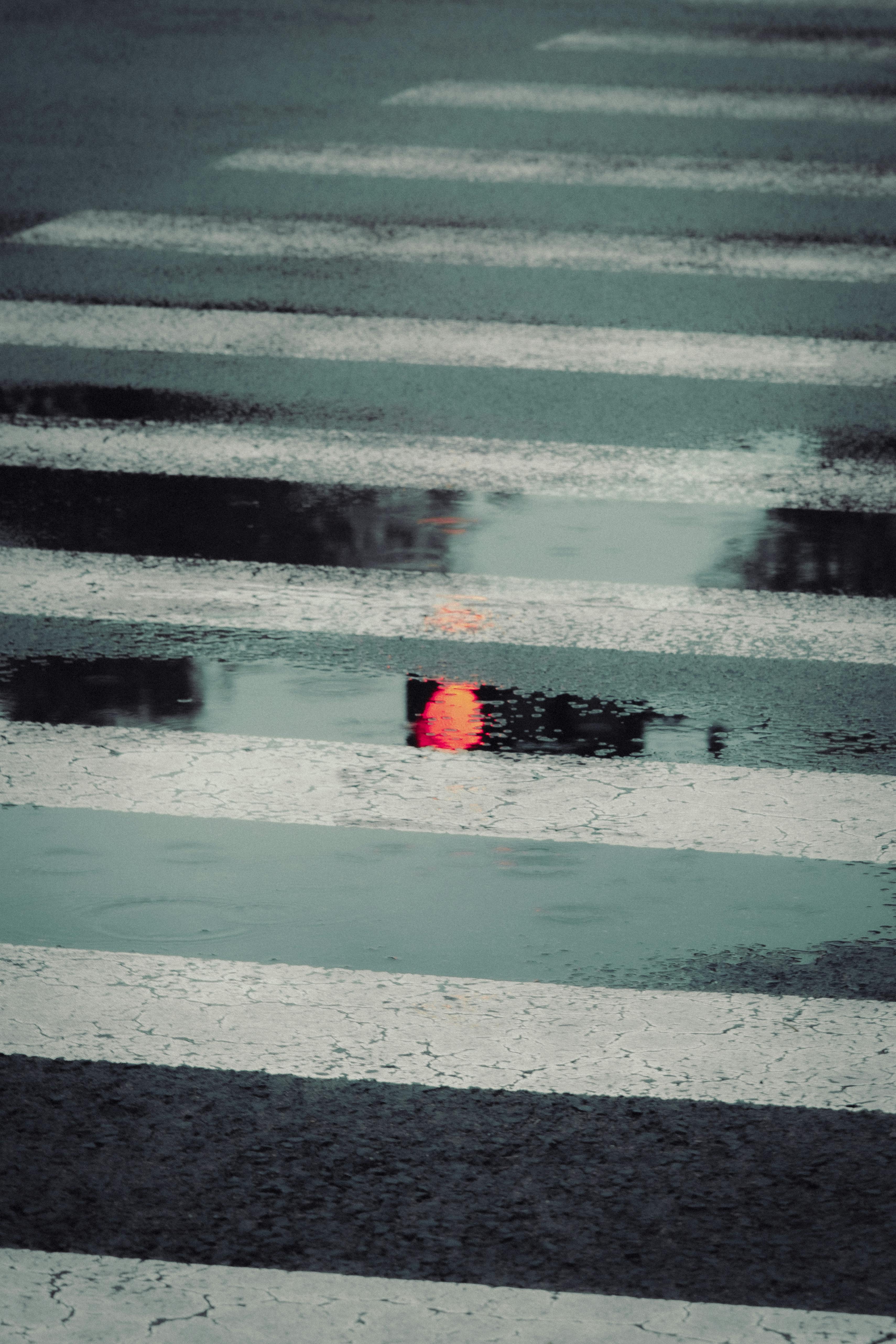 Traffic Light Reflection in Puddle on Crosswalk · Free Stock Photo