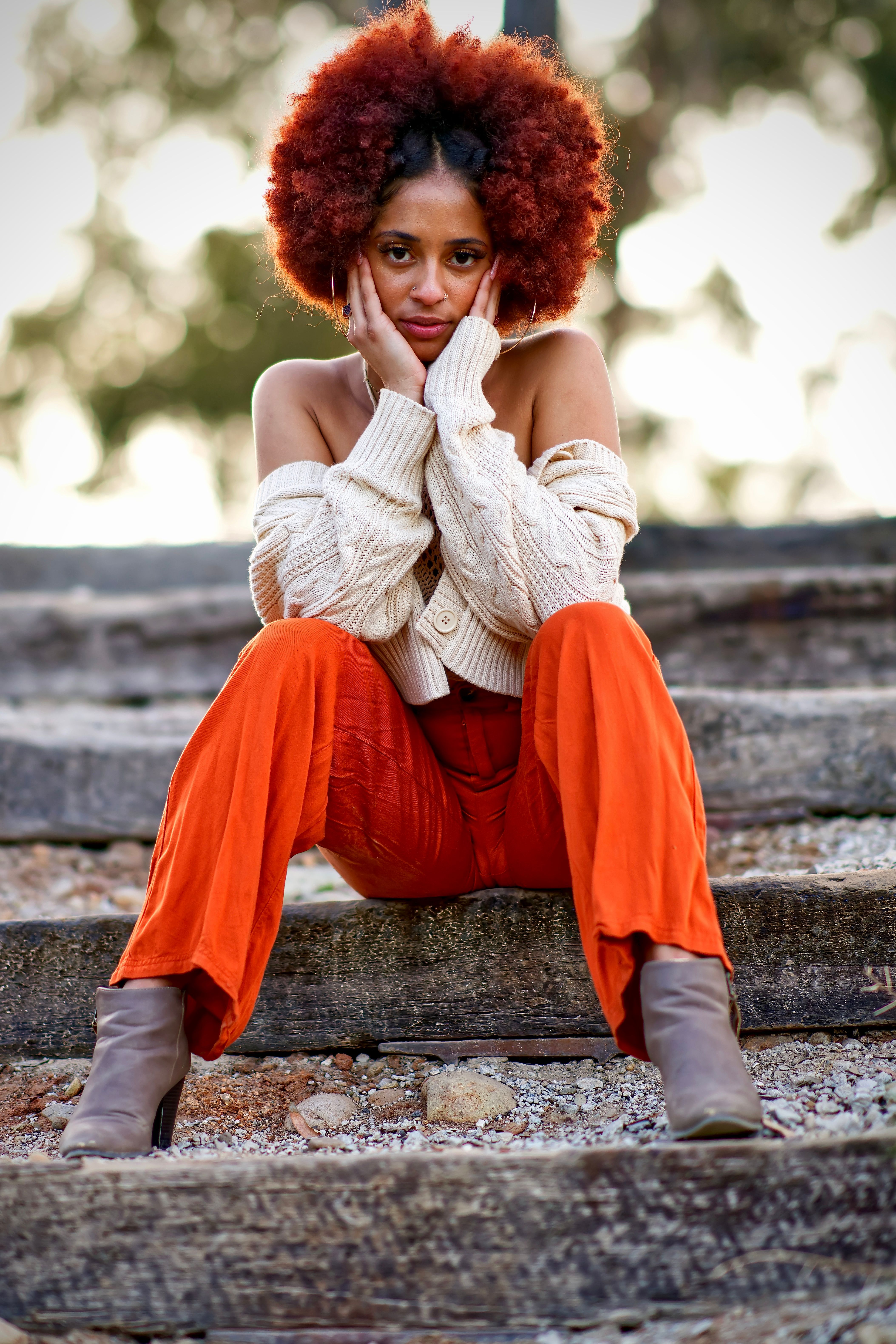 Portrait of a Female Model Wearing an Afro Sitting on Outdoor Steps ...