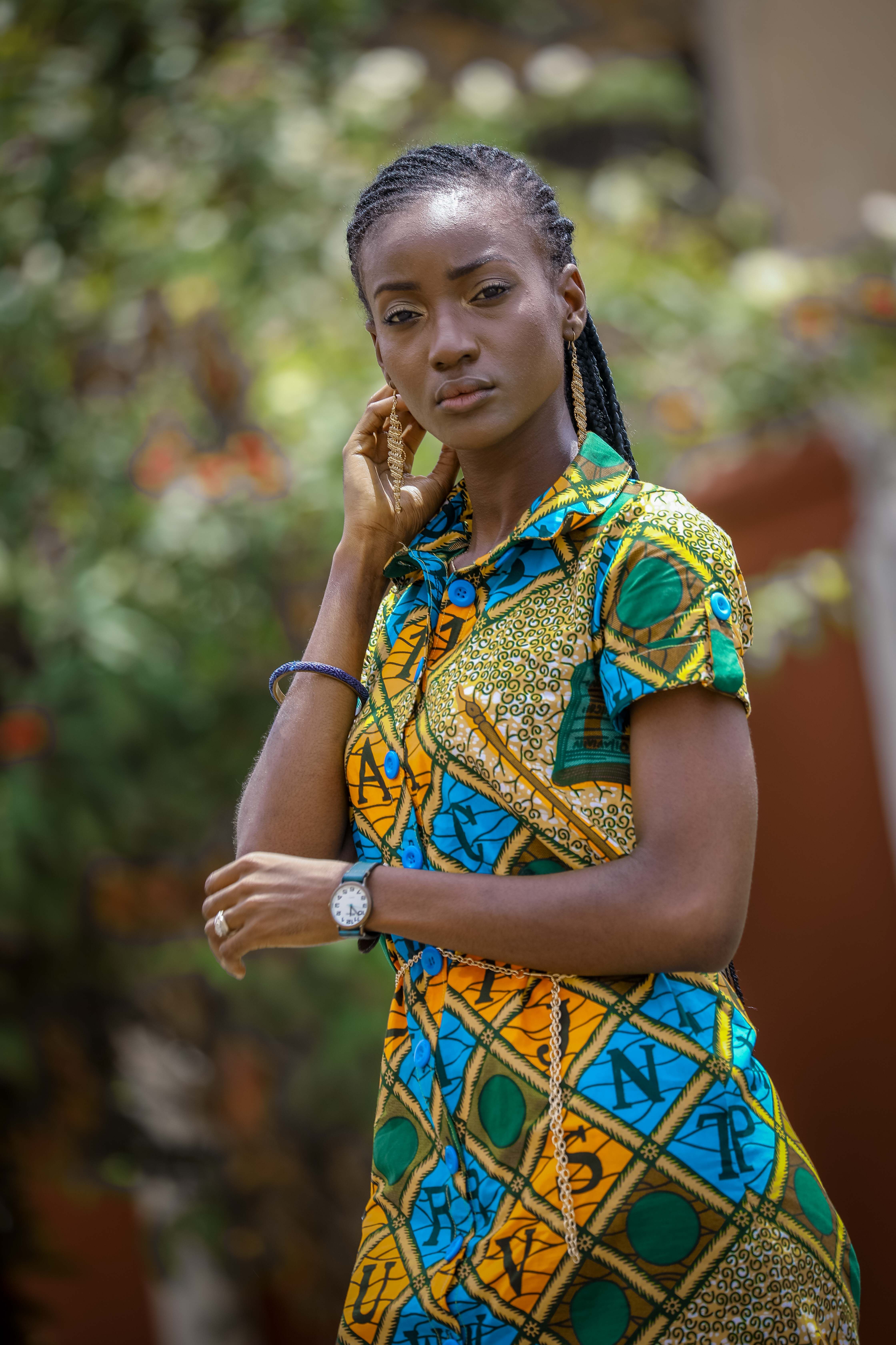 Woman Standing While Wearing Multi-colored Dress · Free Stock Photo