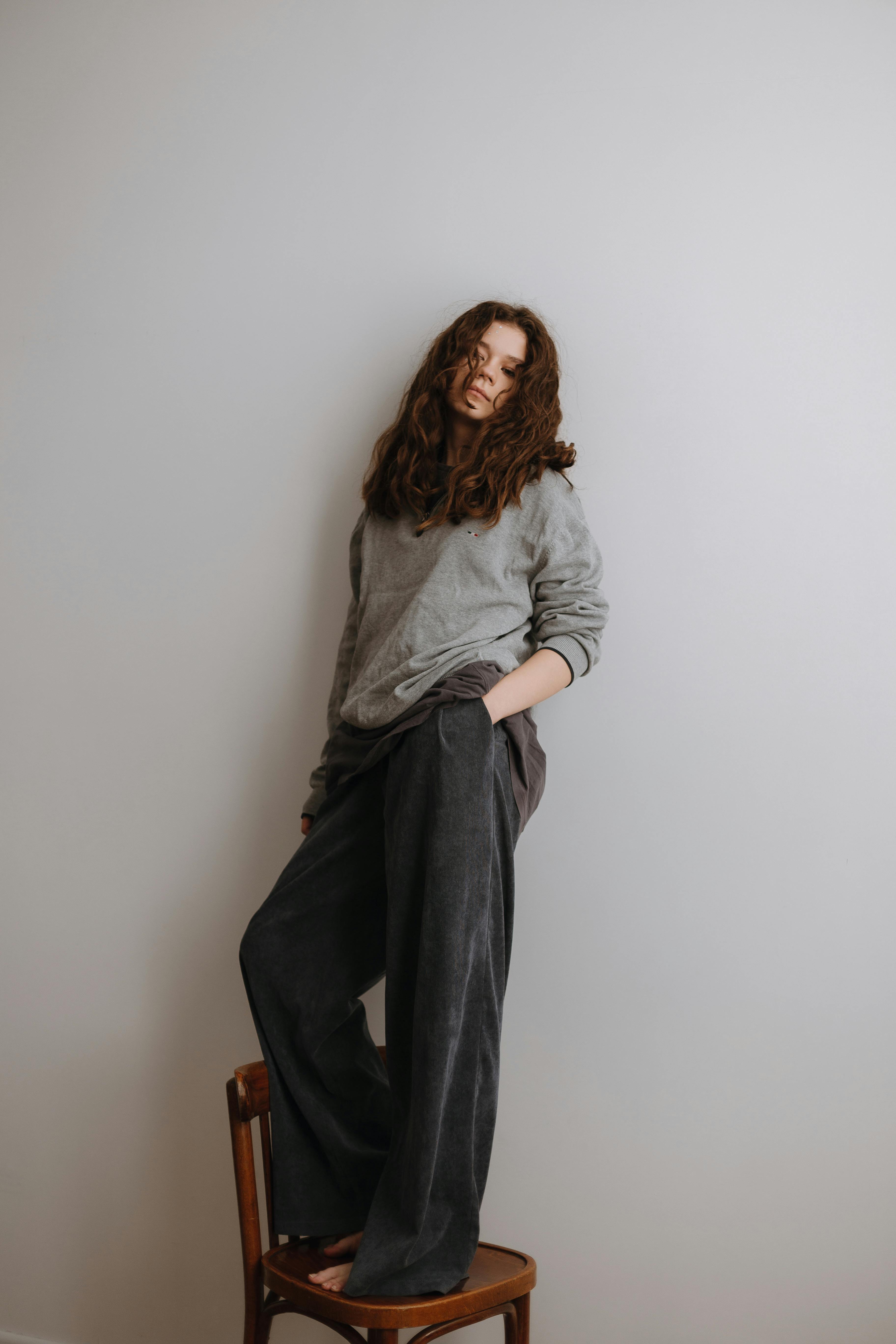 Woman Standing on Chair · Free Stock Photo