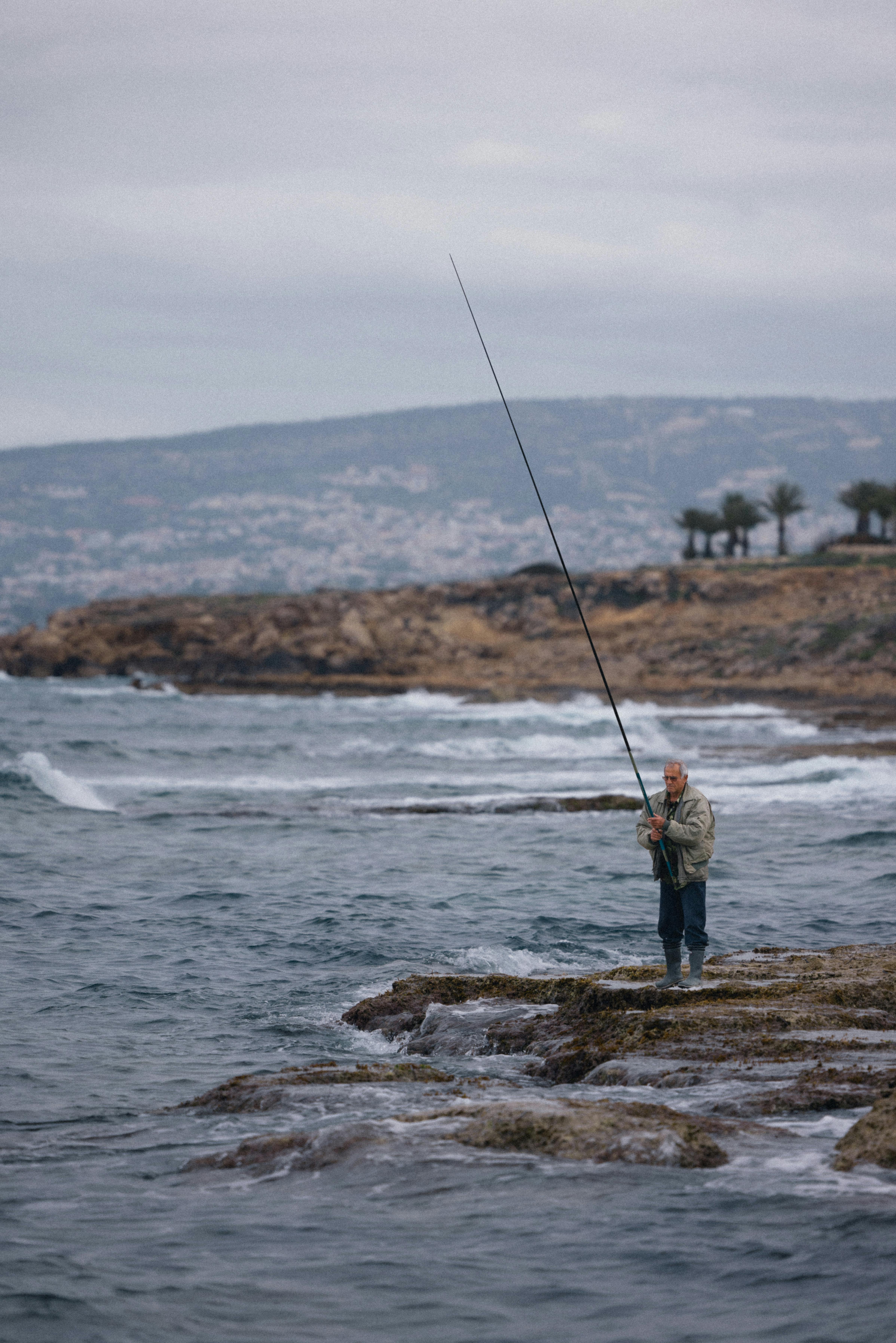 Man Fishing at Sea · Free Stock Photo