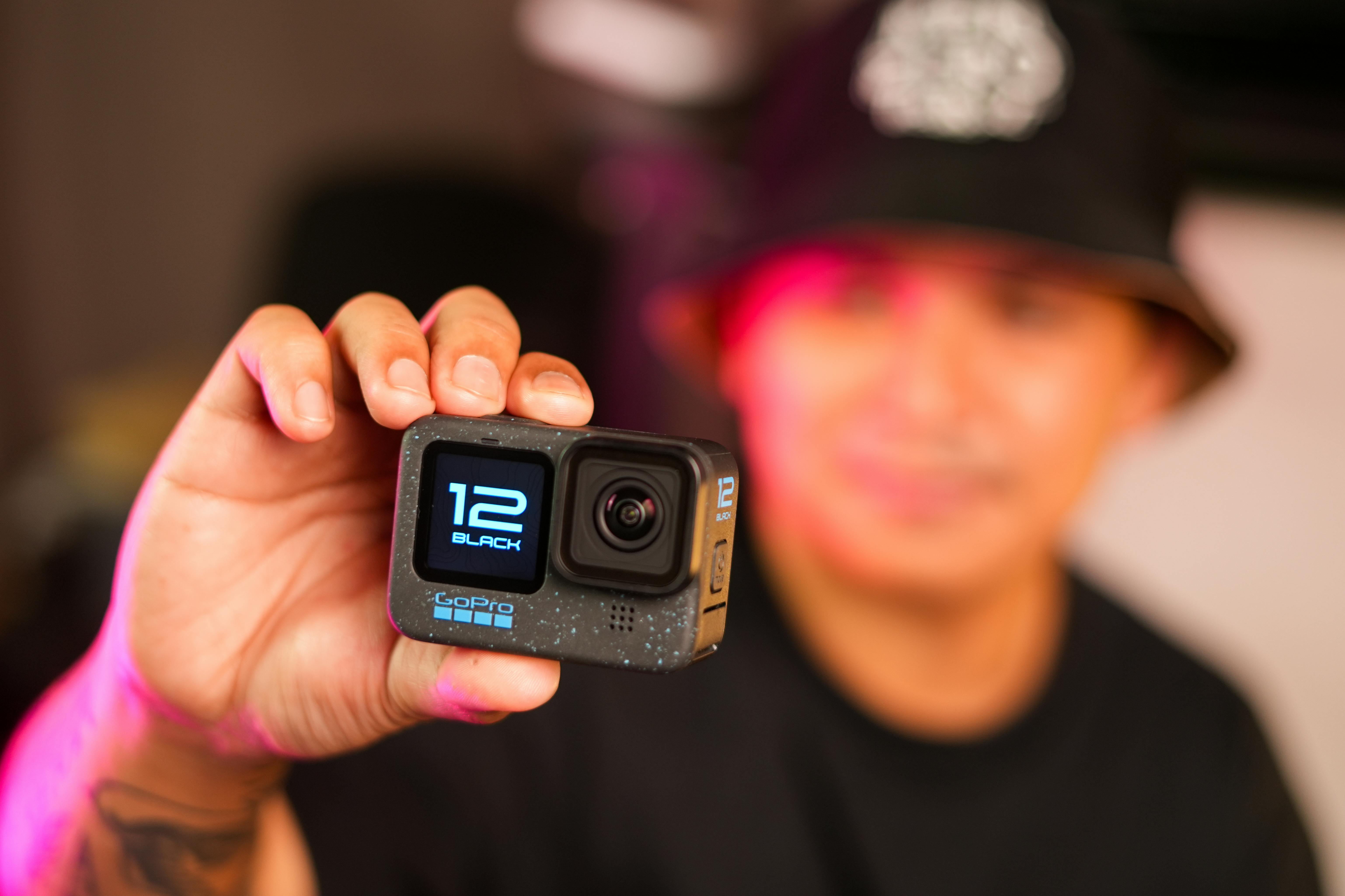 Close-up of a Man Holding a Small GoPro Hero Camera · Free Stock Photo