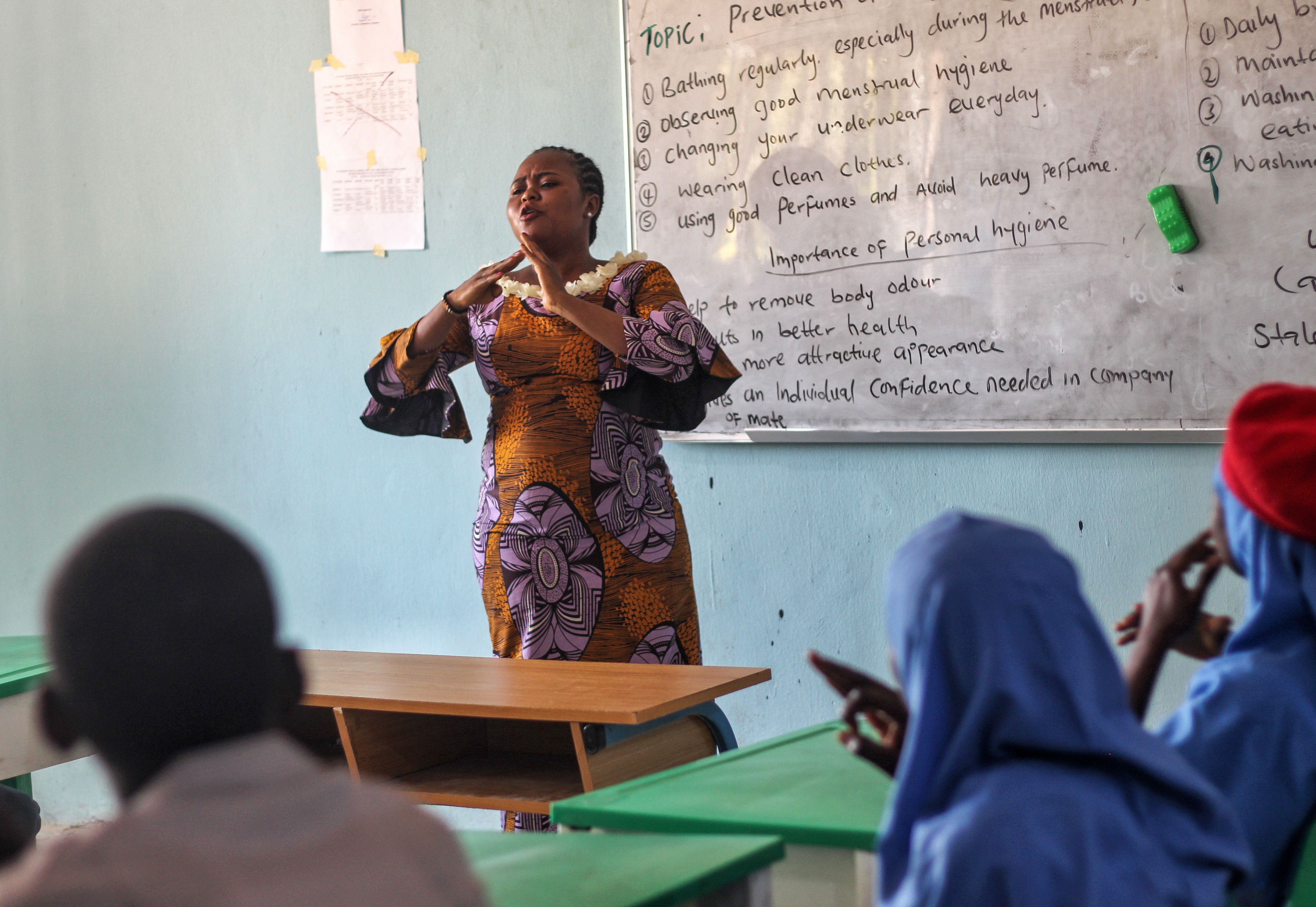 A Woman Teaching Students about Hygiene · Free Stock Photo