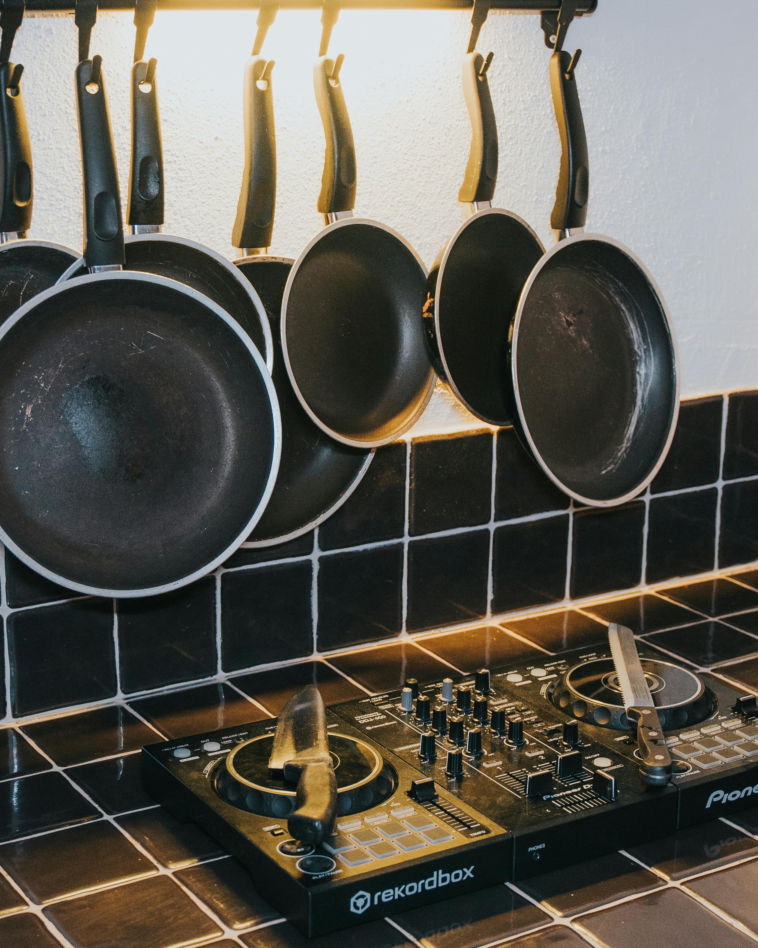 Pans Hanging over Stove · Free Stock Photo