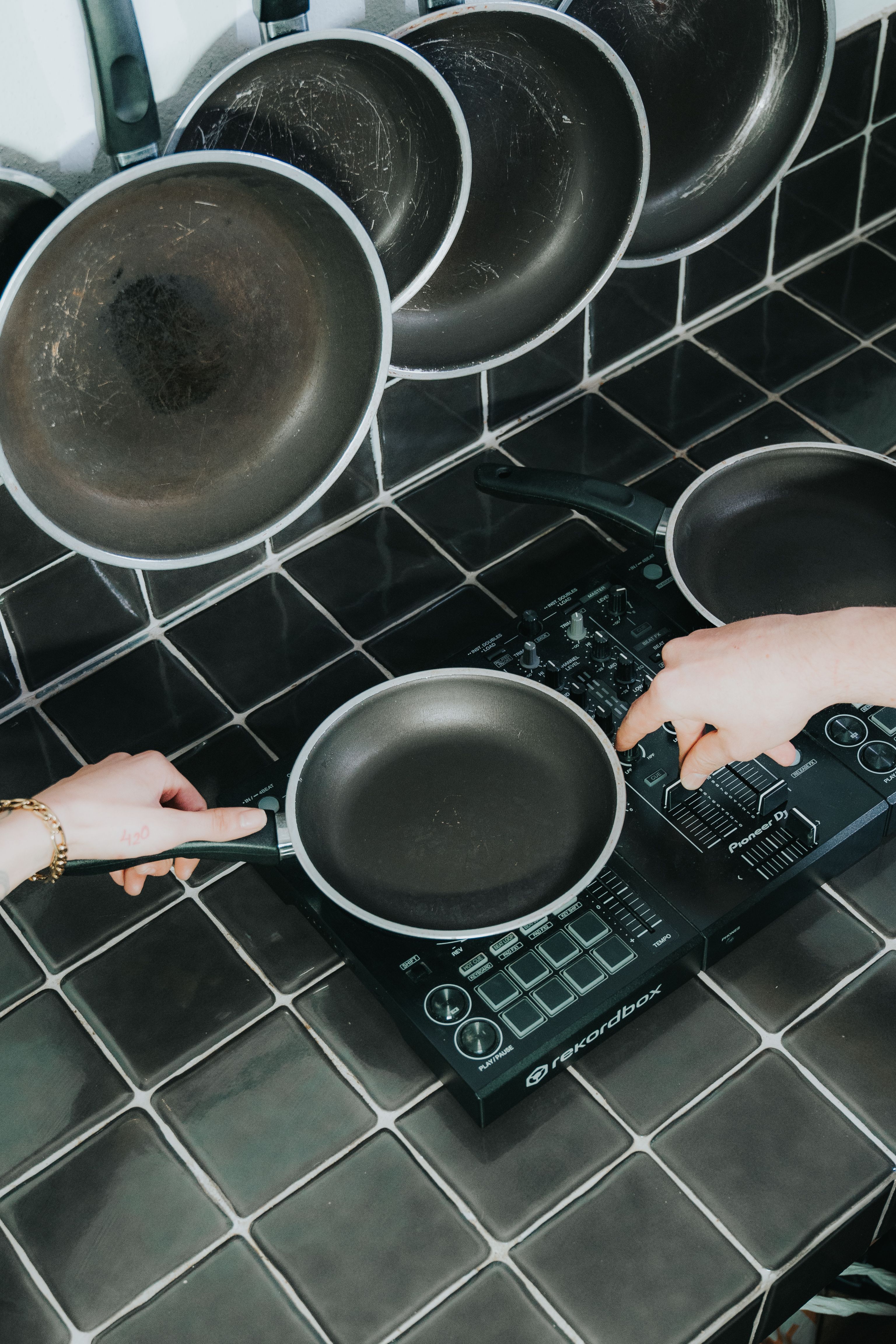 Hands Holding Pots on Stove · Free Stock Photo