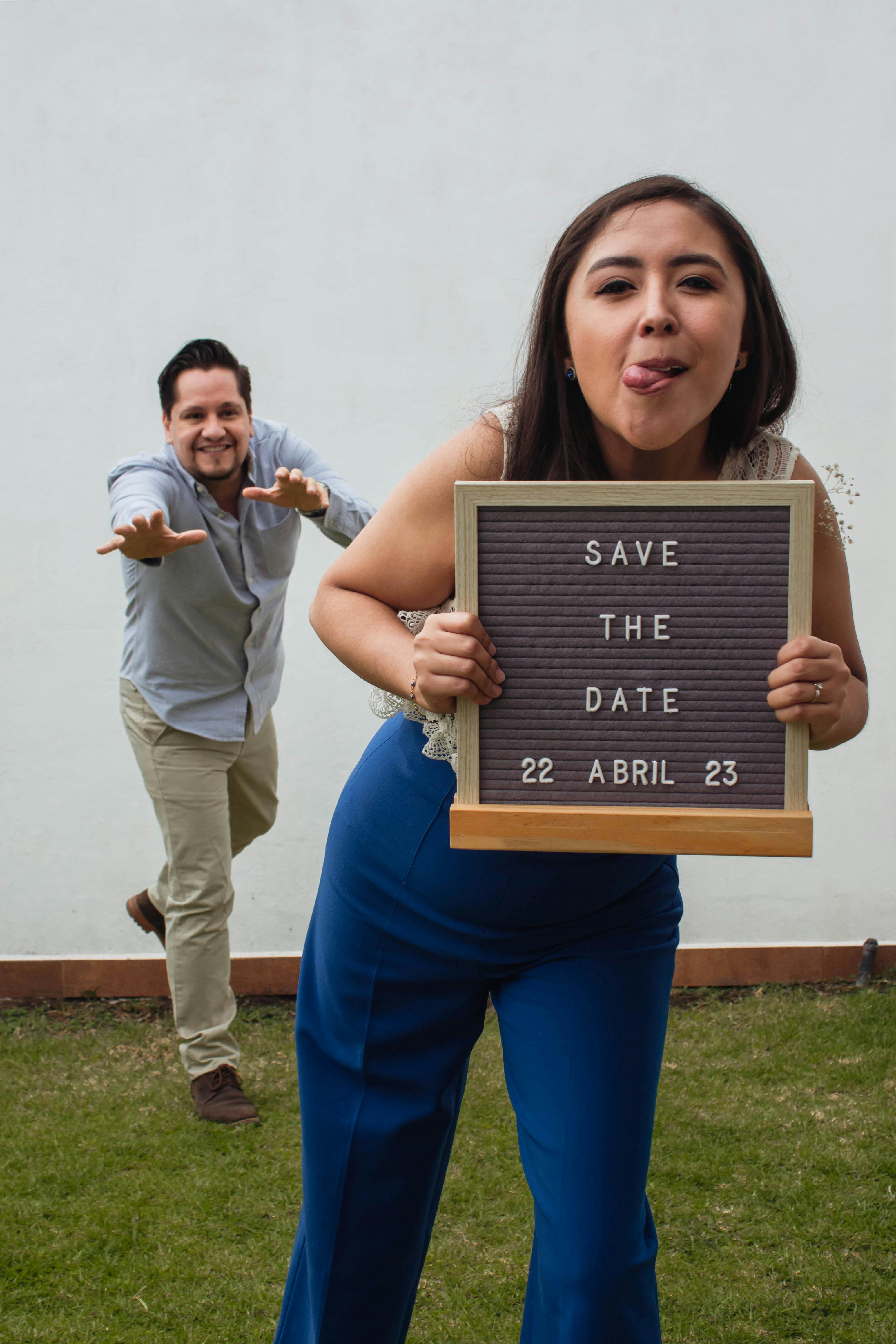 Funny Couple with Sign · Free Stock Photo