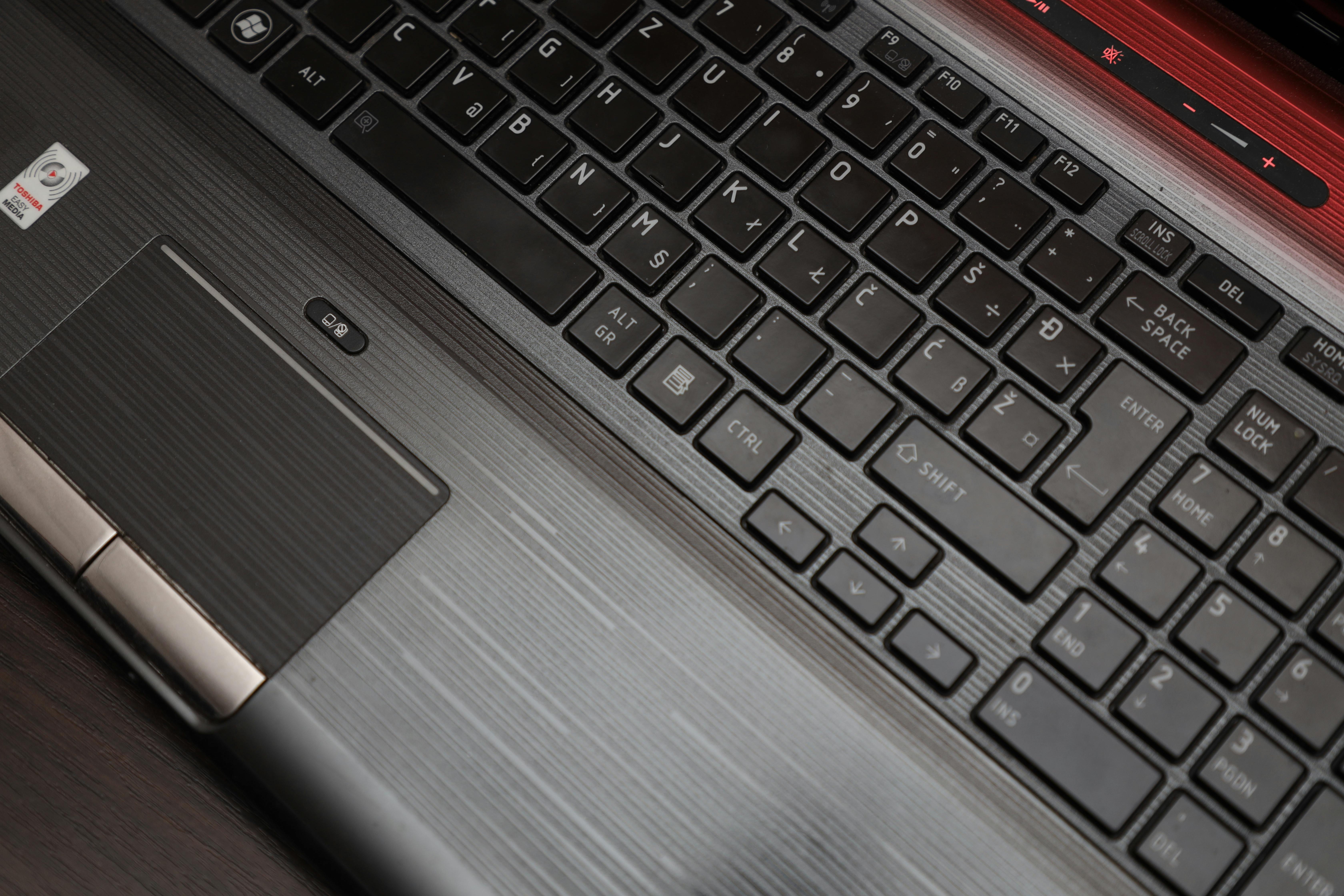 A close up of a laptop computer with a keyboard · Free Stock Photo