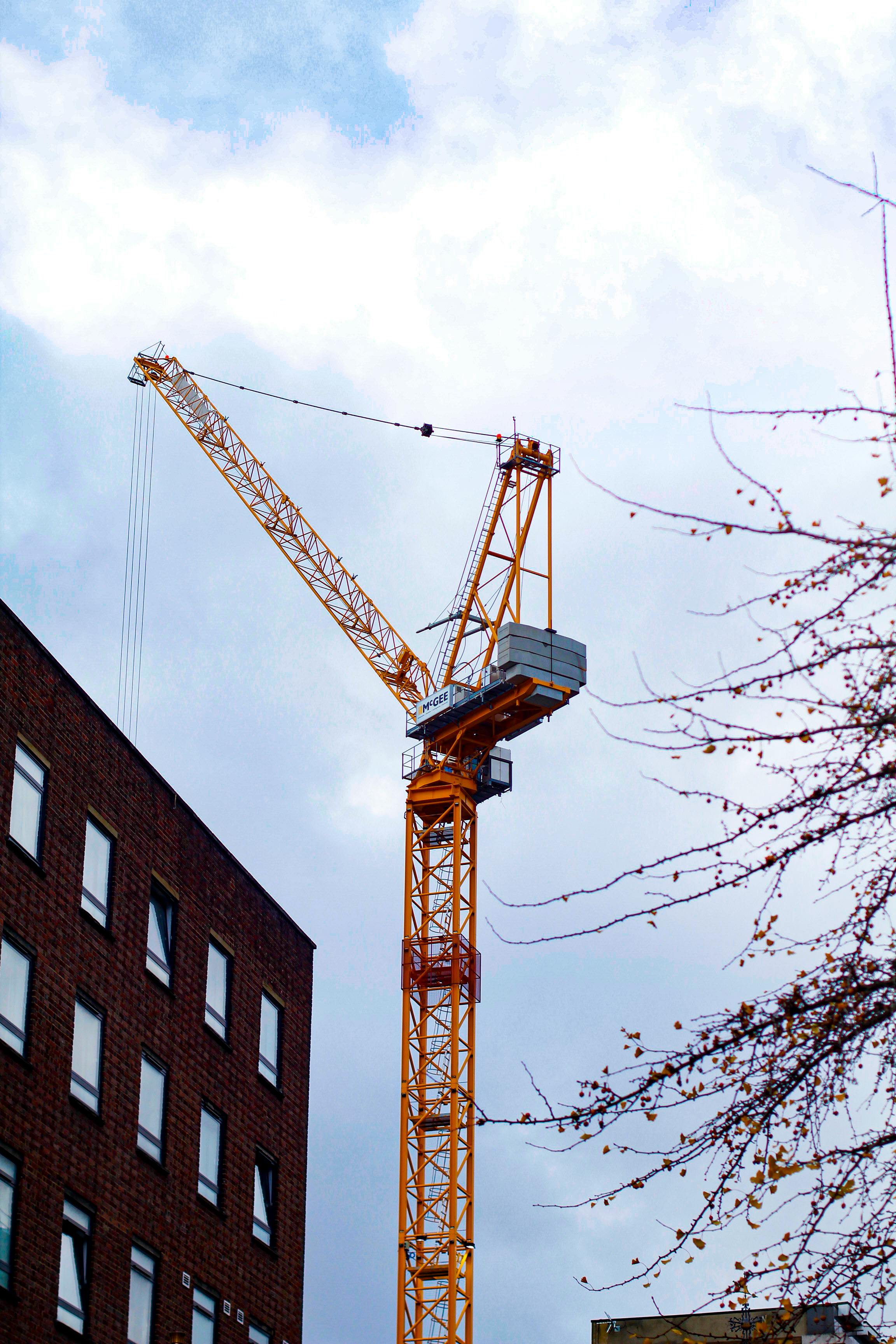 Construction site with cranes in city · Free Stock Photo