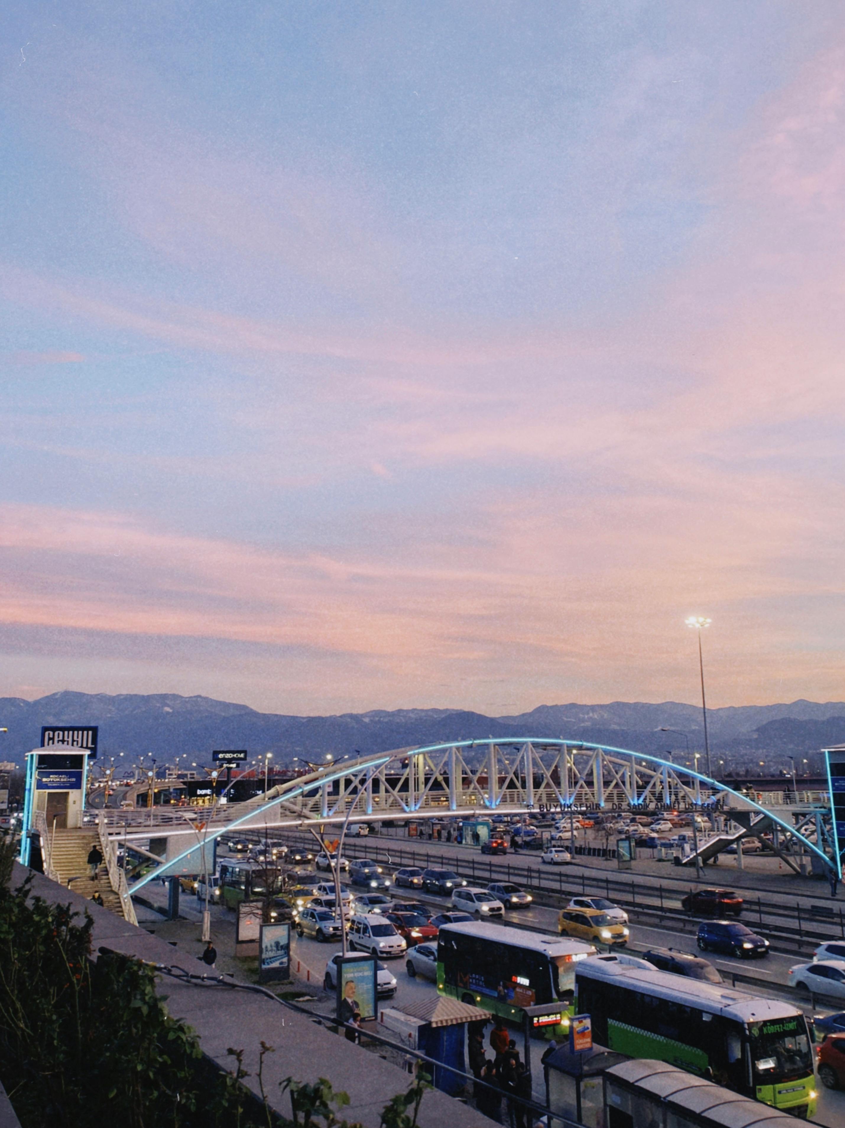 Cars on Street under Footbridge · Free Stock Photo