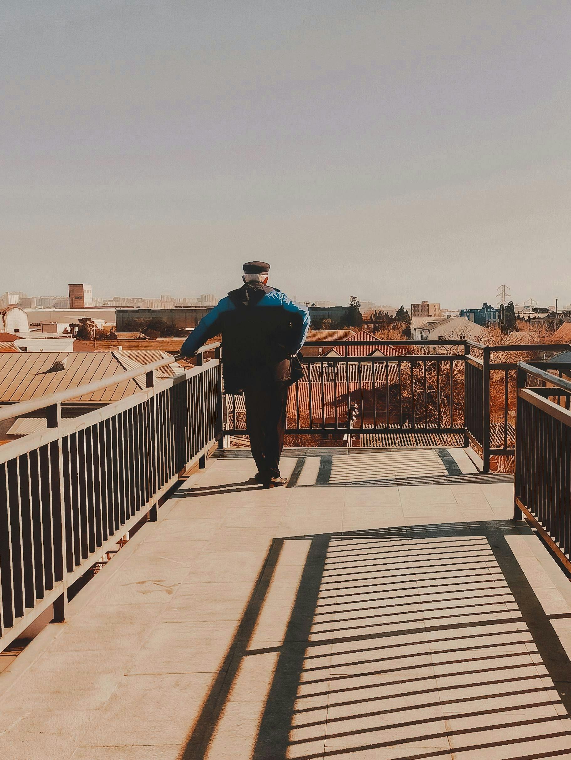 Man Standing in Window with Shutters · Free Stock Photo