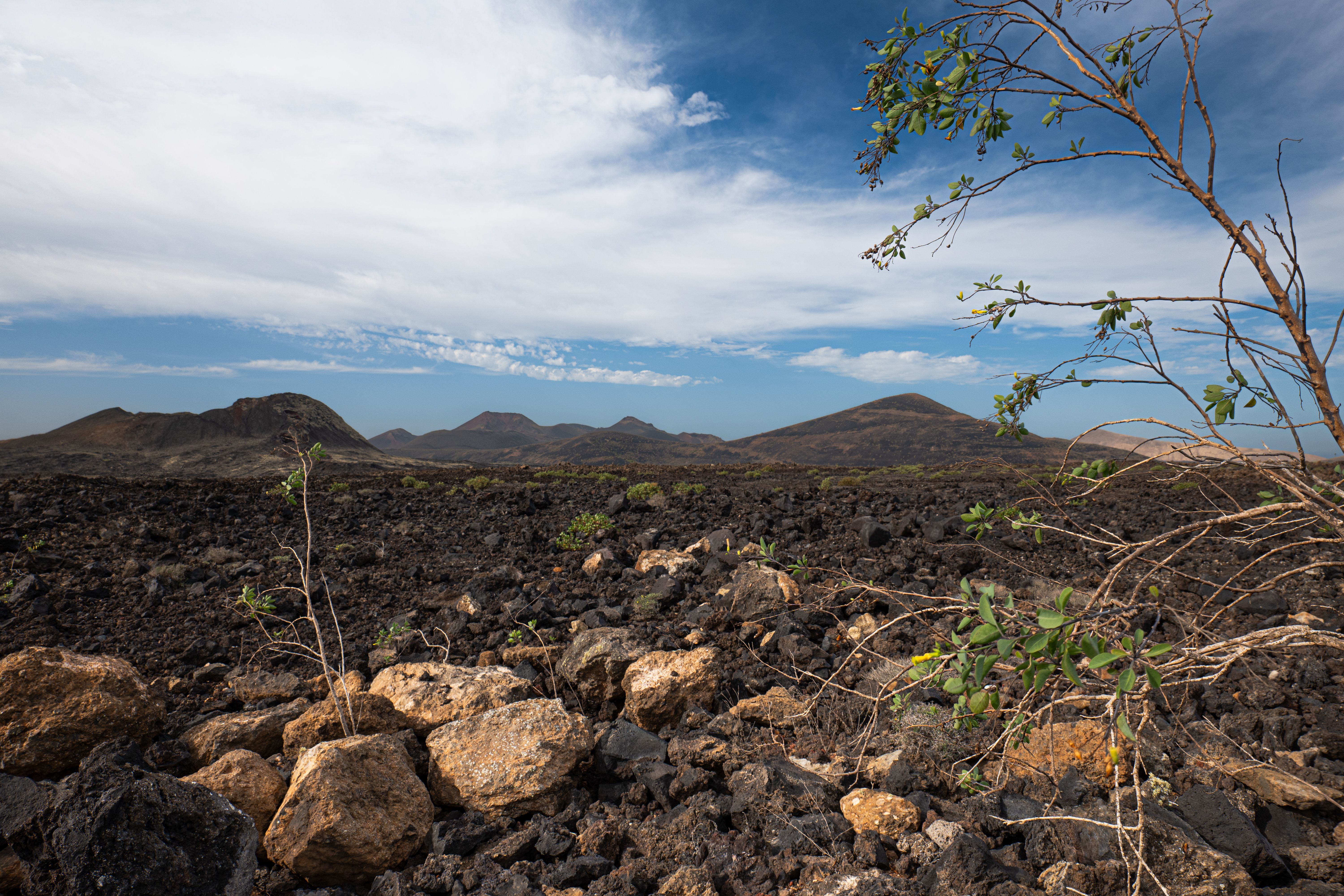 A Rocky Ground and Hills in Distance · Free Stock Photo