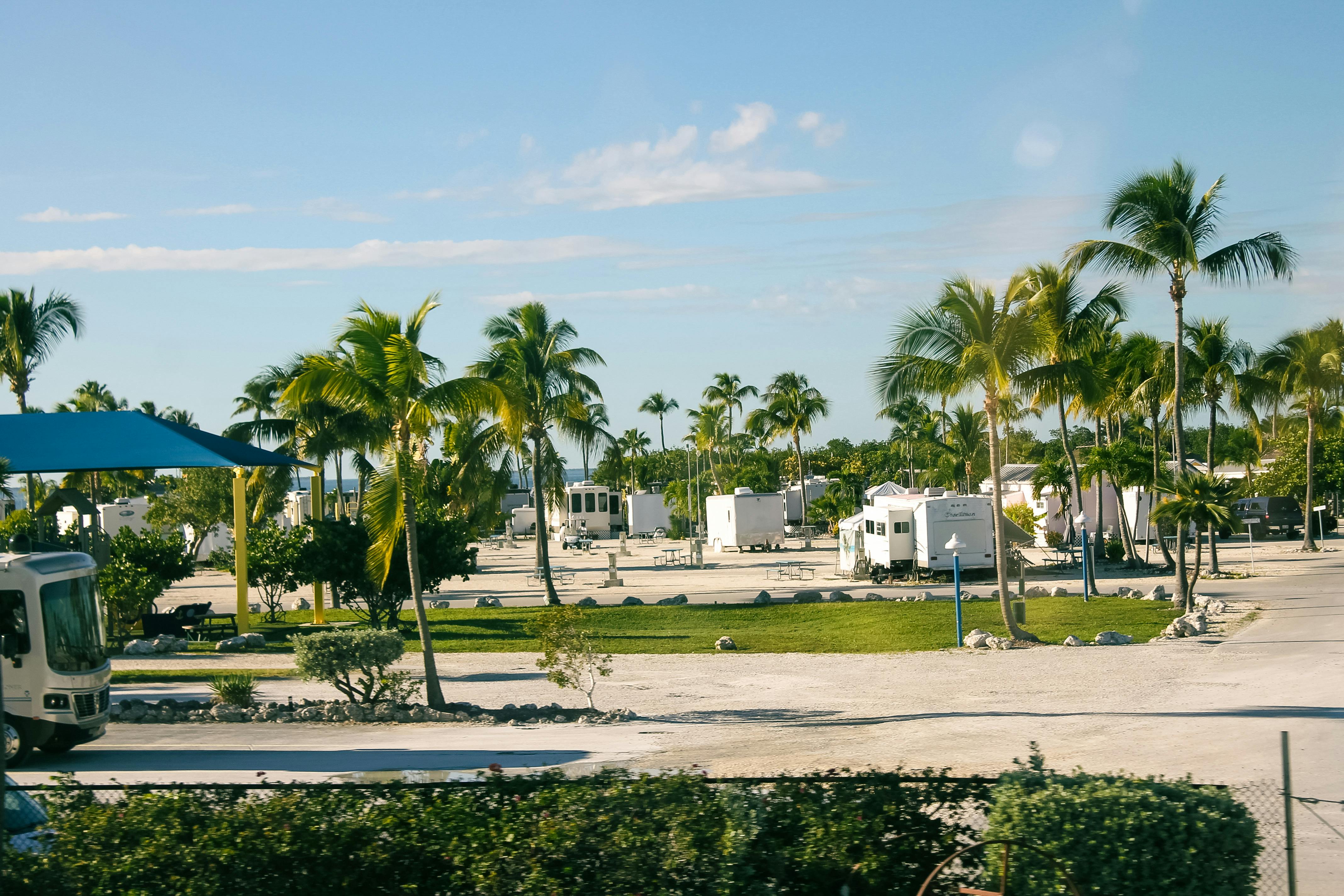 View of an RV and Trailer Park with Palm Trees by the Water · Free ...