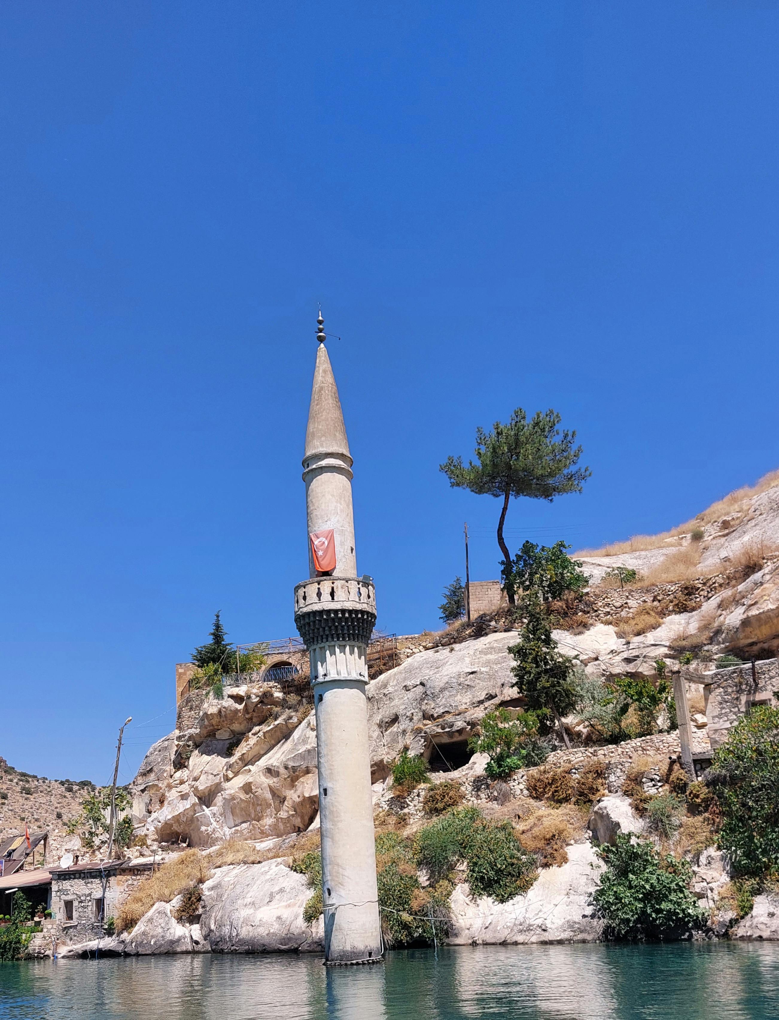 Minaret in Water in Mountains Landscape · Free Stock Photo