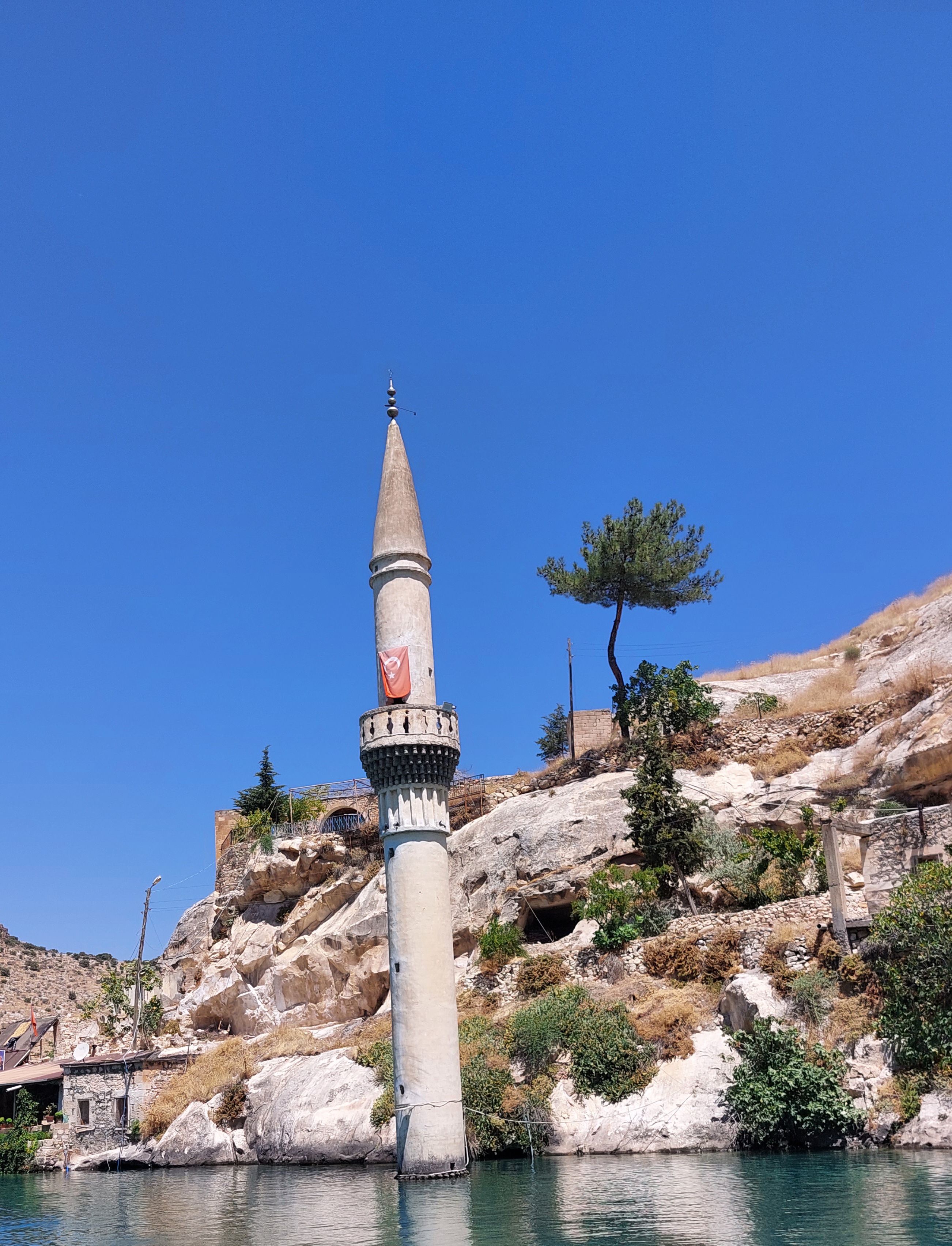 Minaret in Water in Mountains Landscape · Free Stock Photo