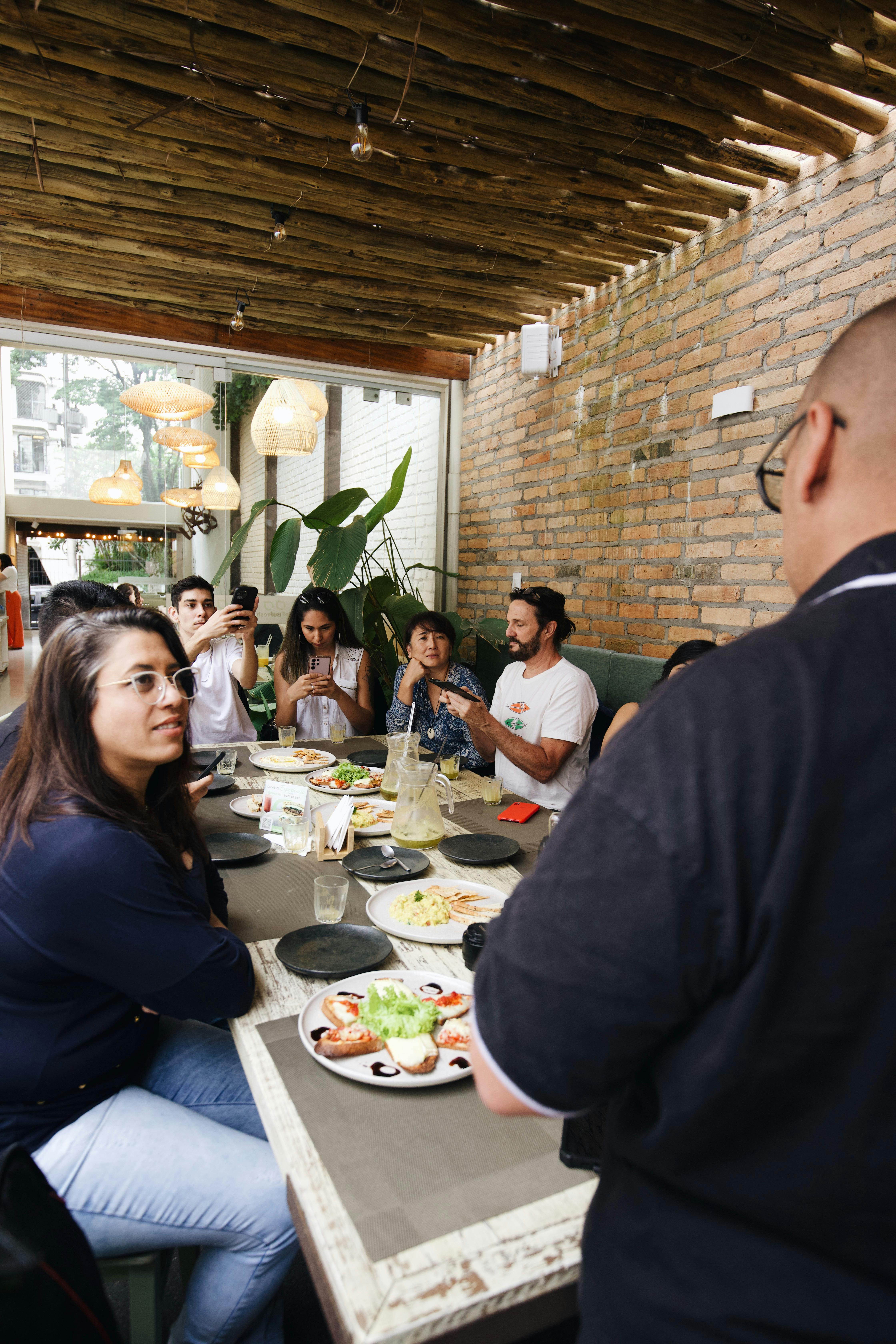 Group Sitting at Table · Free Stock Photo