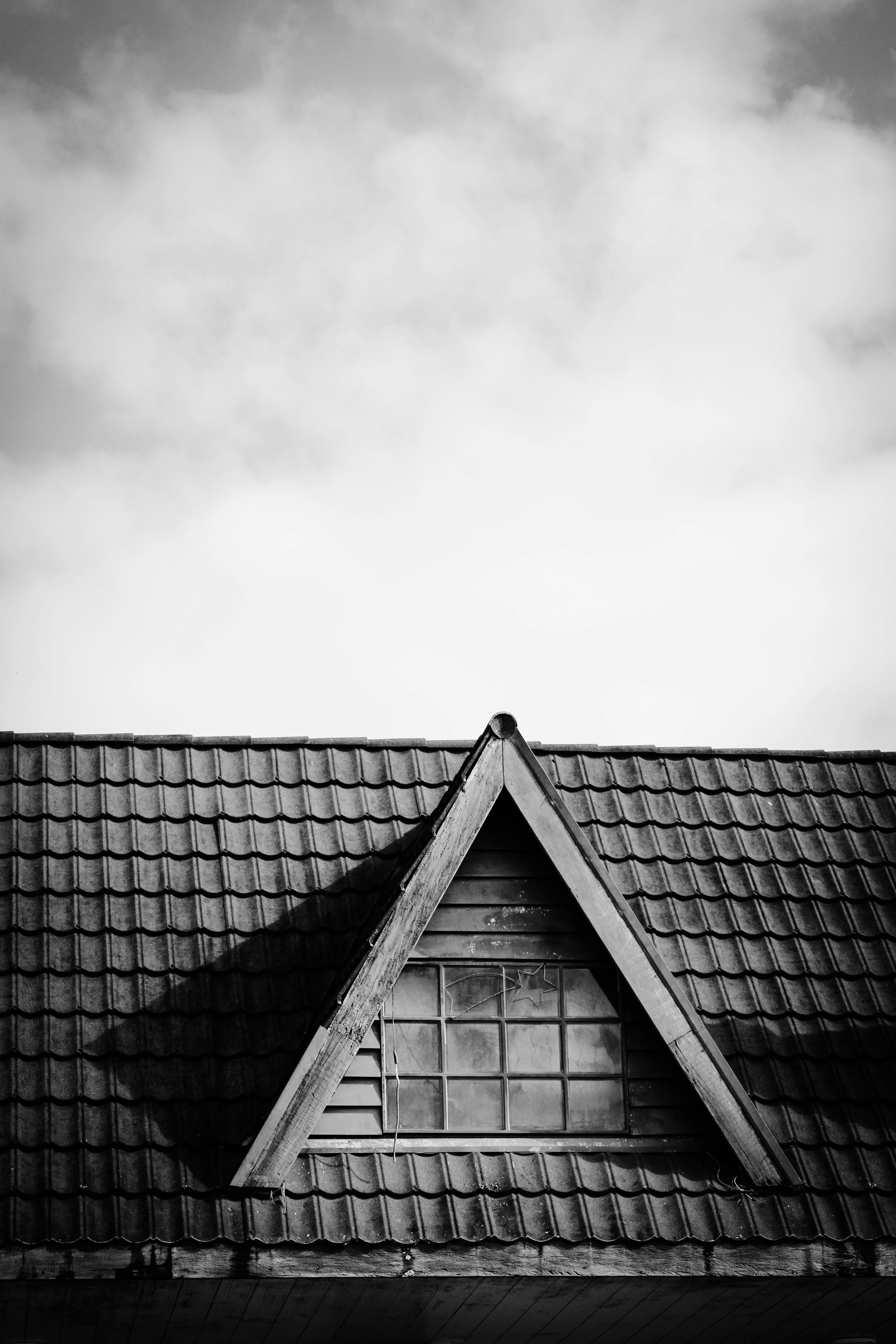 View of a Roof and Attic Window of an Old House · Free Stock Photo