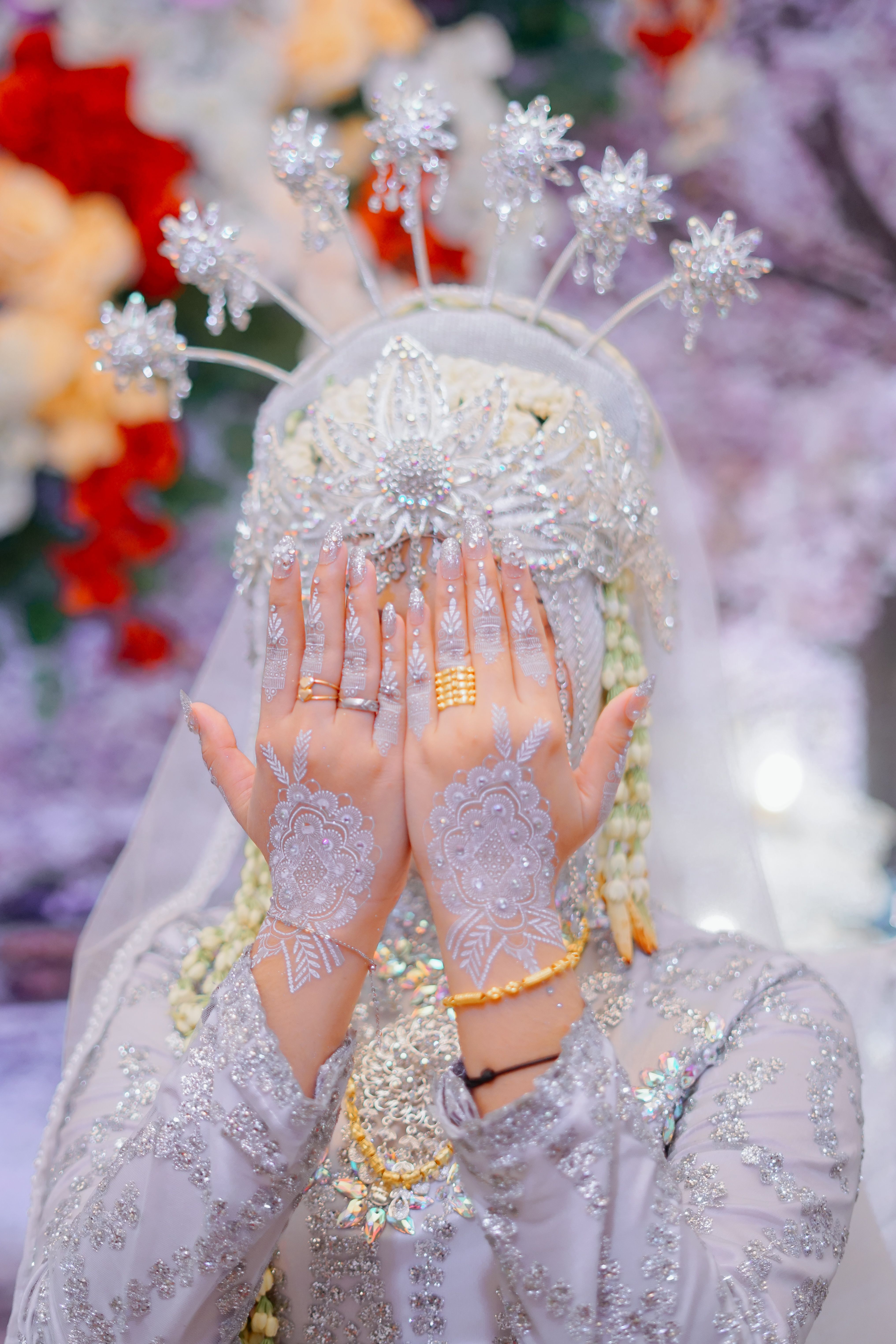 Photo of a Bride in Traditional Clothing Covering Her Face with Hands ...