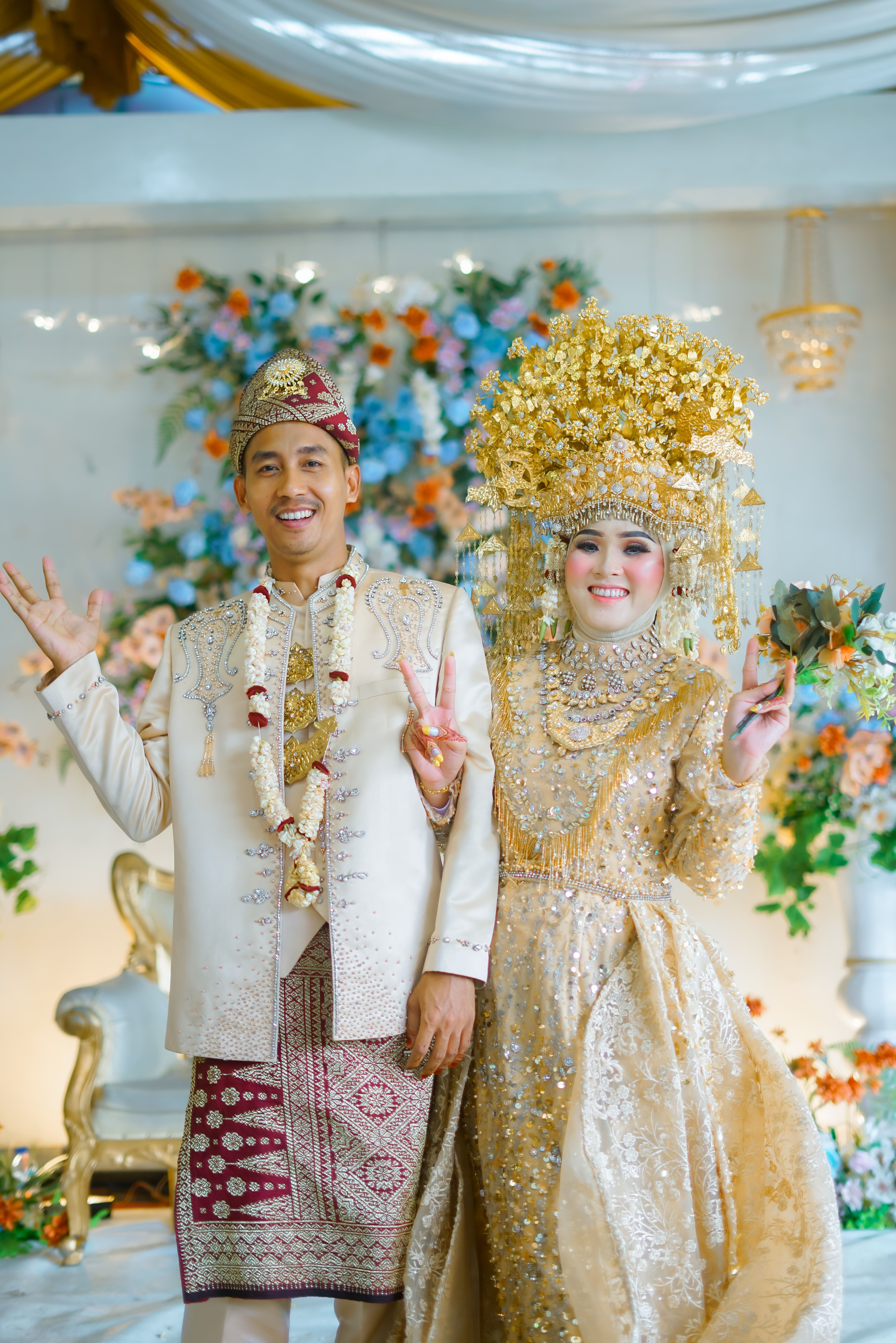 Bride and Groom in Traditional Clothing Smiling during a Ceremony ...