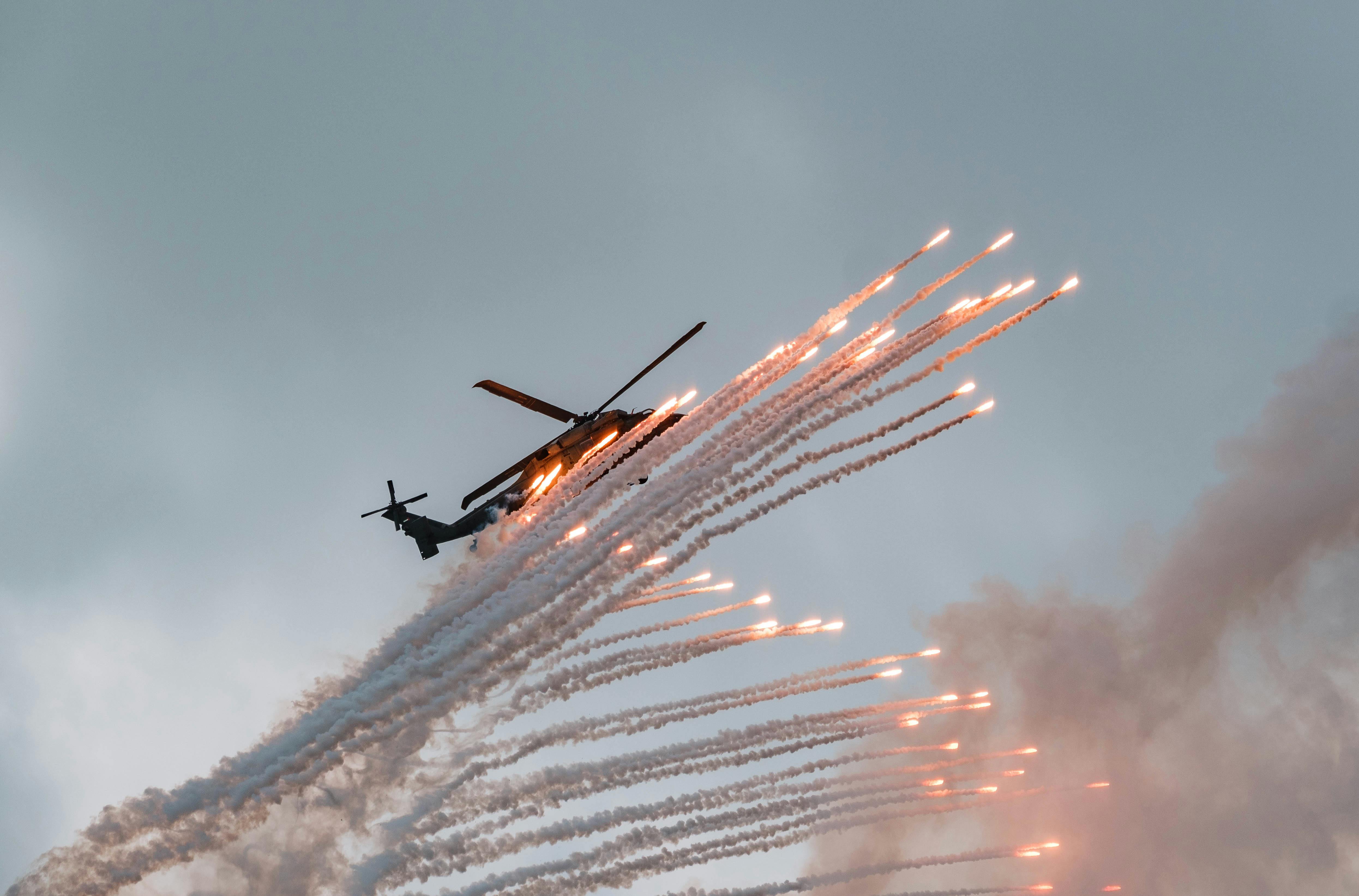 Black Hawk Helicopter Shooting Flares · Free Stock Photo