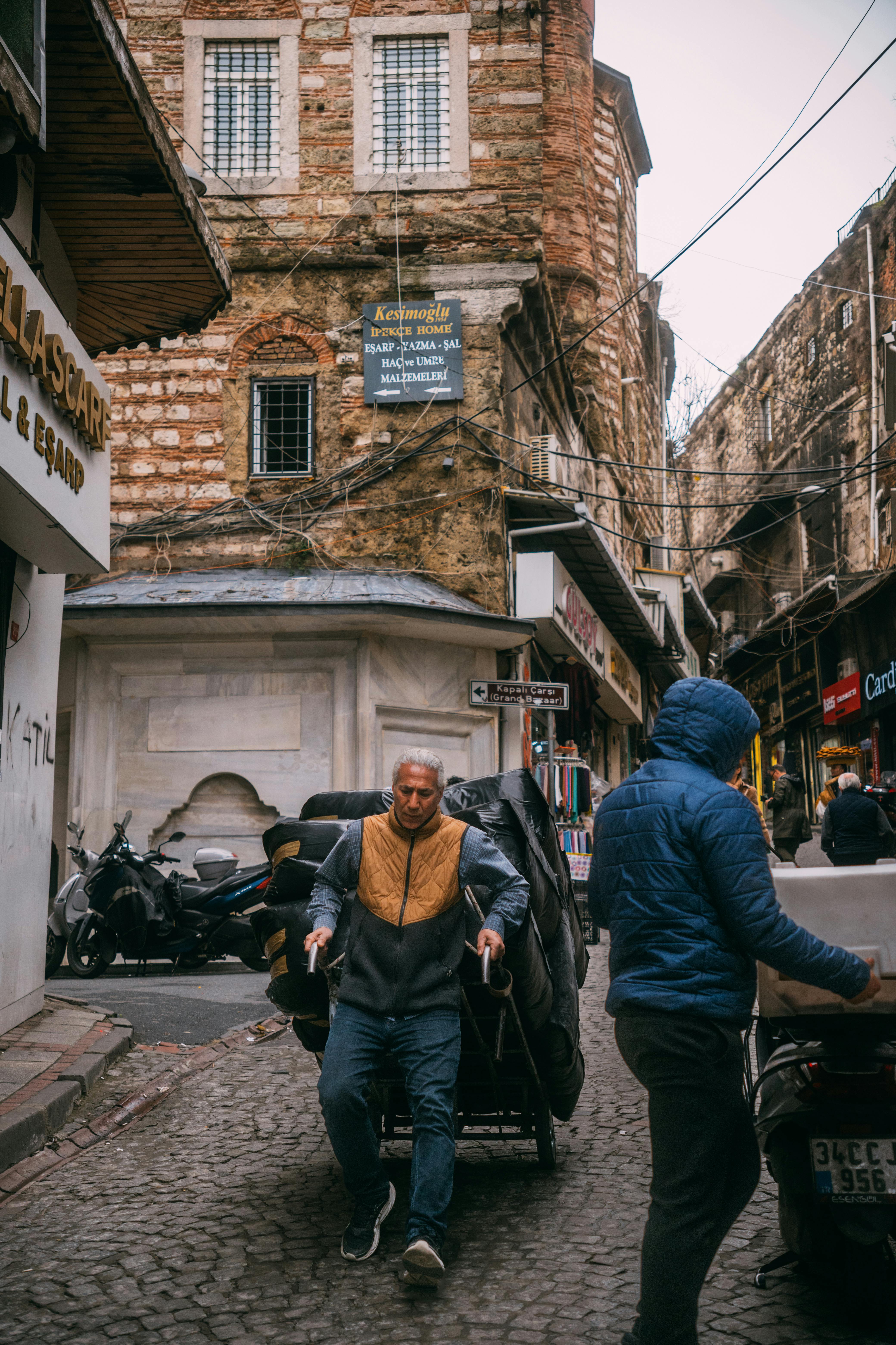 Man Pulling Cart with Hefty Load · Free Stock Photo