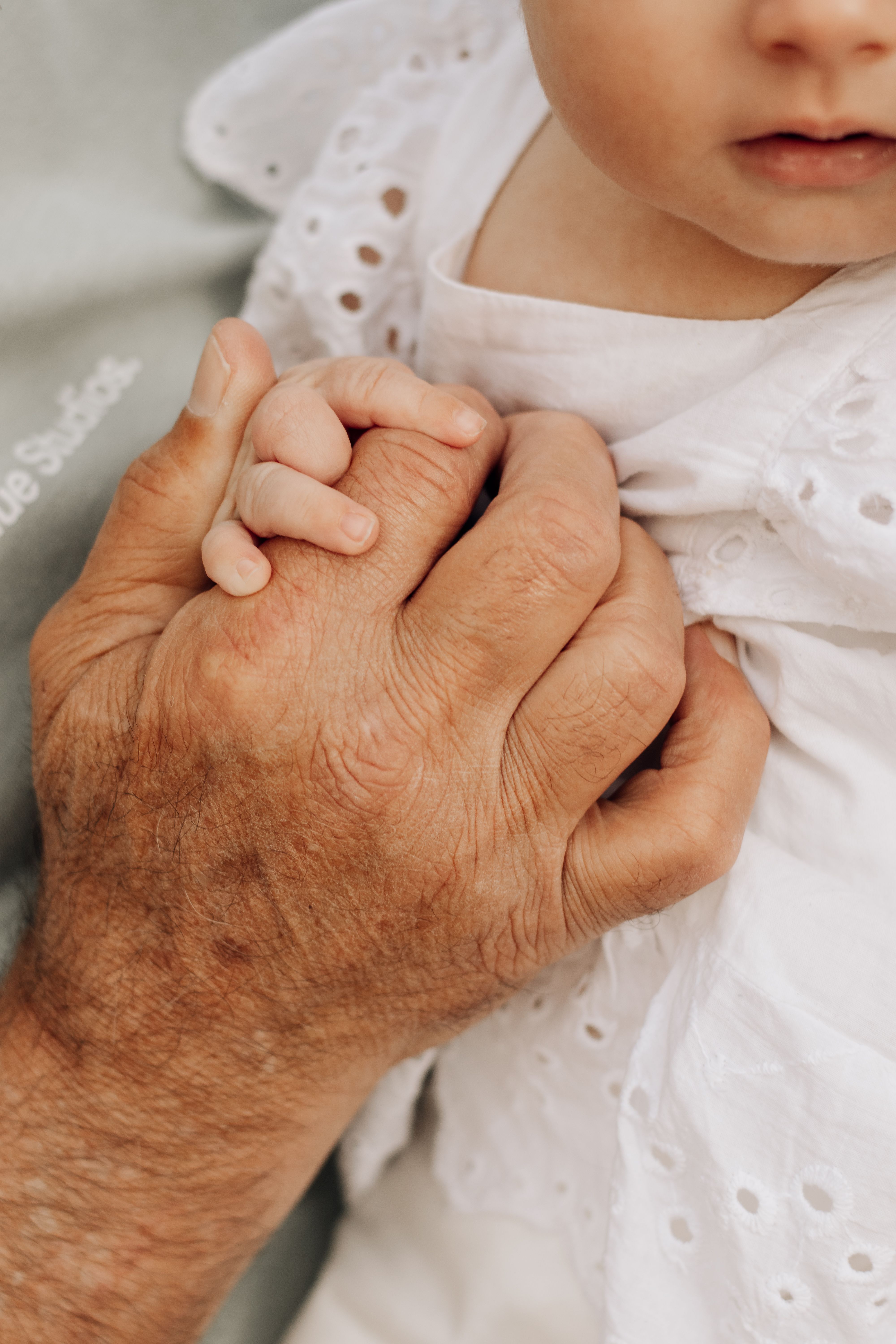 Man Holding a Child in his Arms · Free Stock Photo