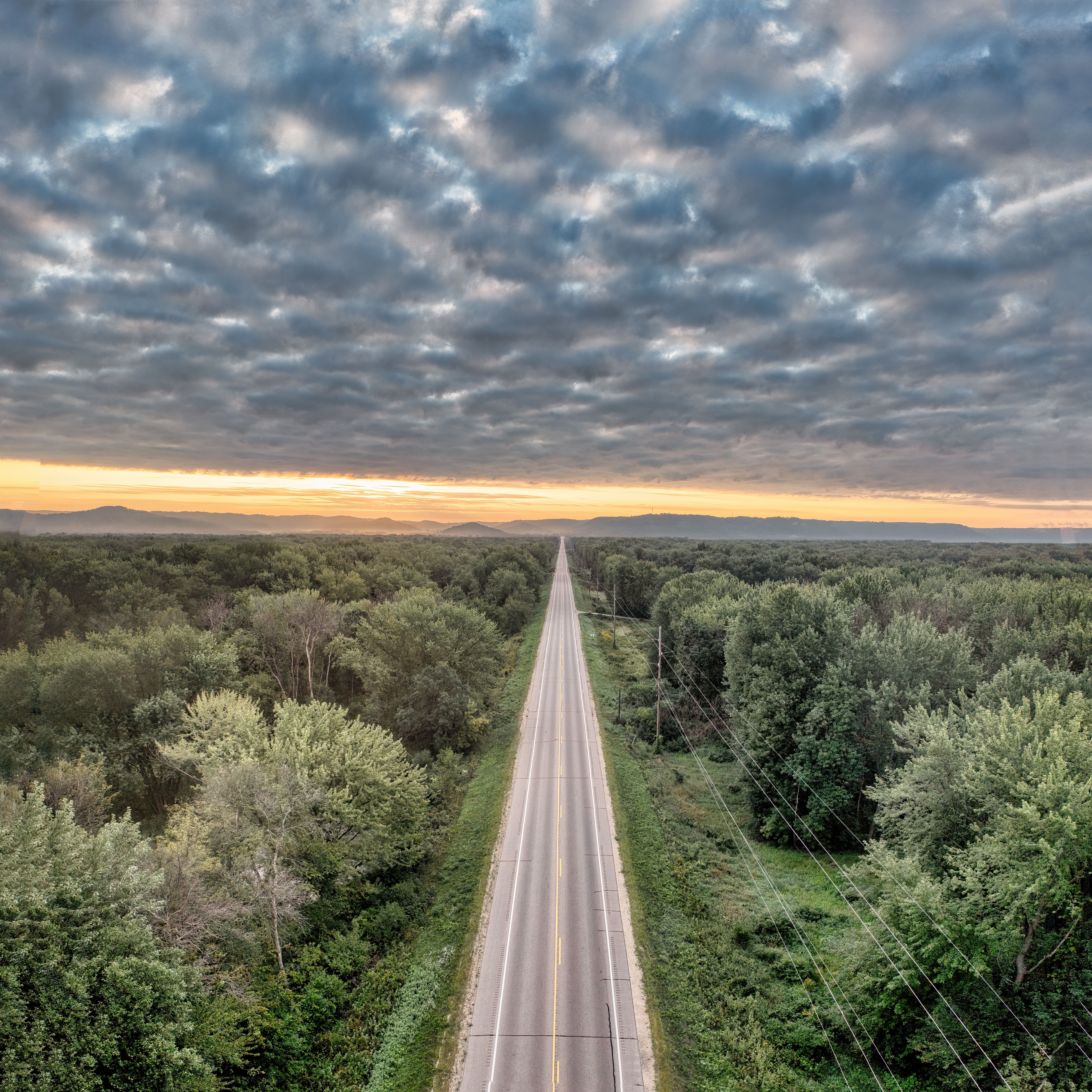 Clouds over Road in Forest on Plains at Sunset · Free Stock Photo