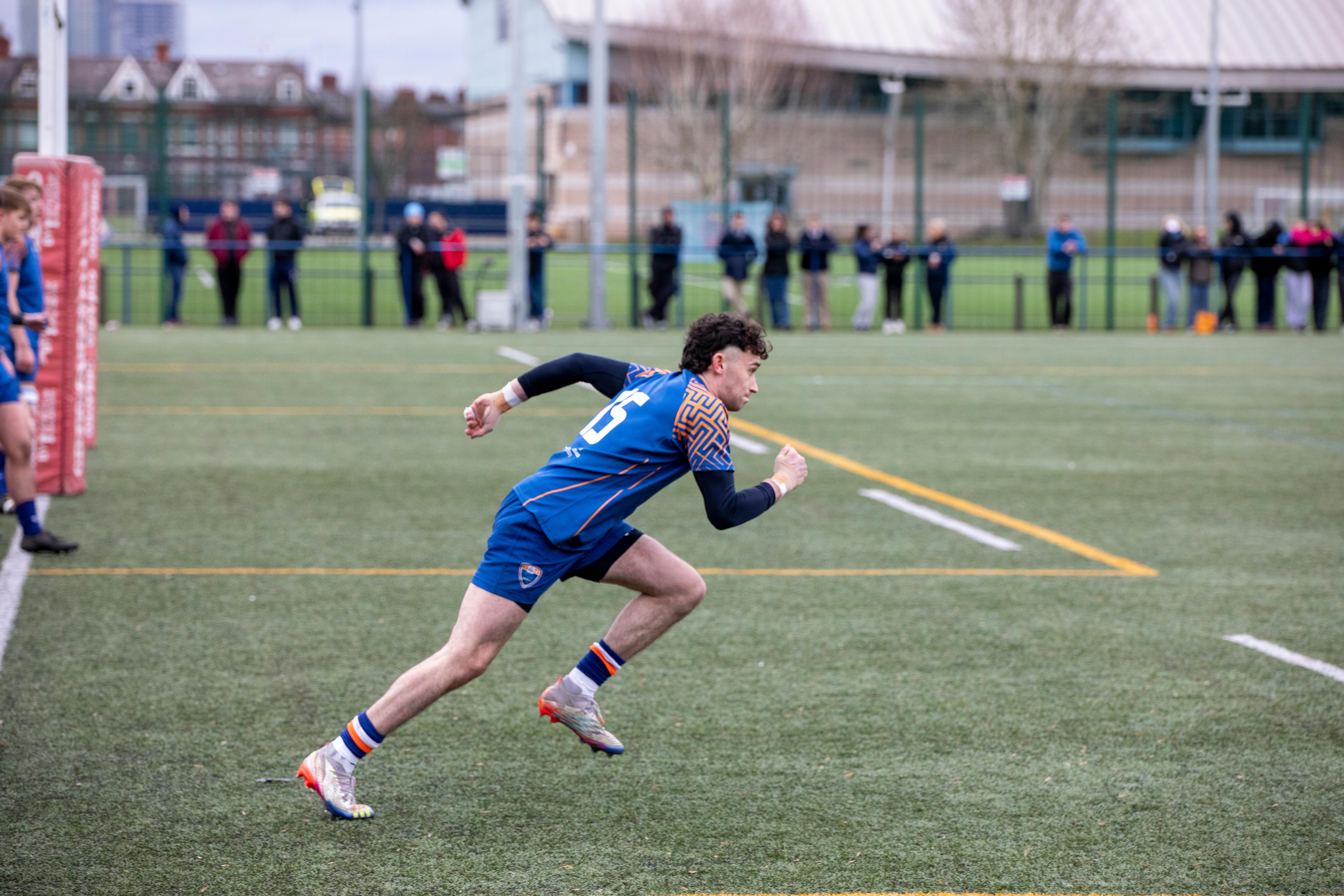 Rugby Player Running at Stadium · Free Stock Photo