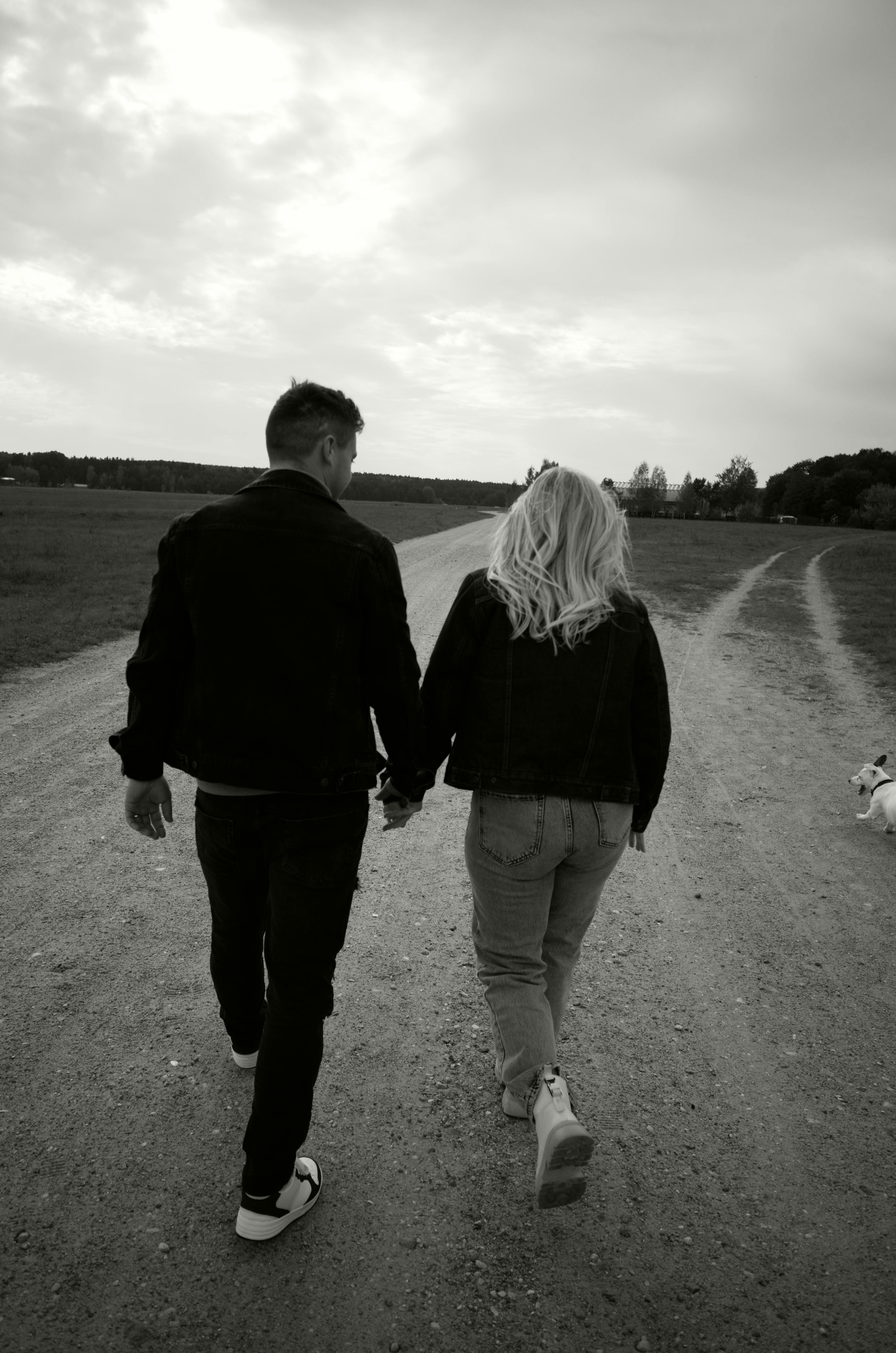 Couple Walking Down A Path