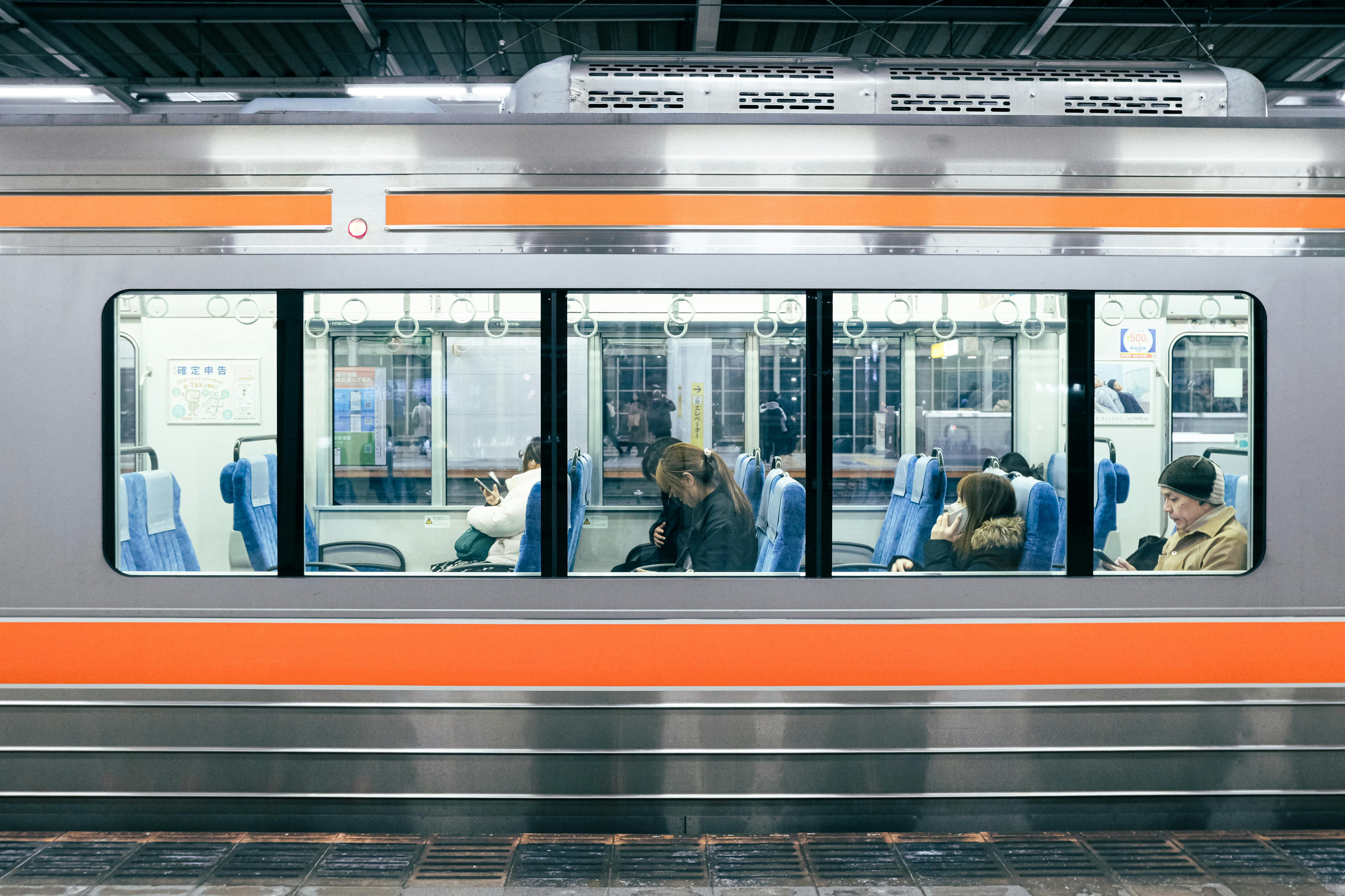 Passengers behind Metro Train Windows · Free Stock Photo