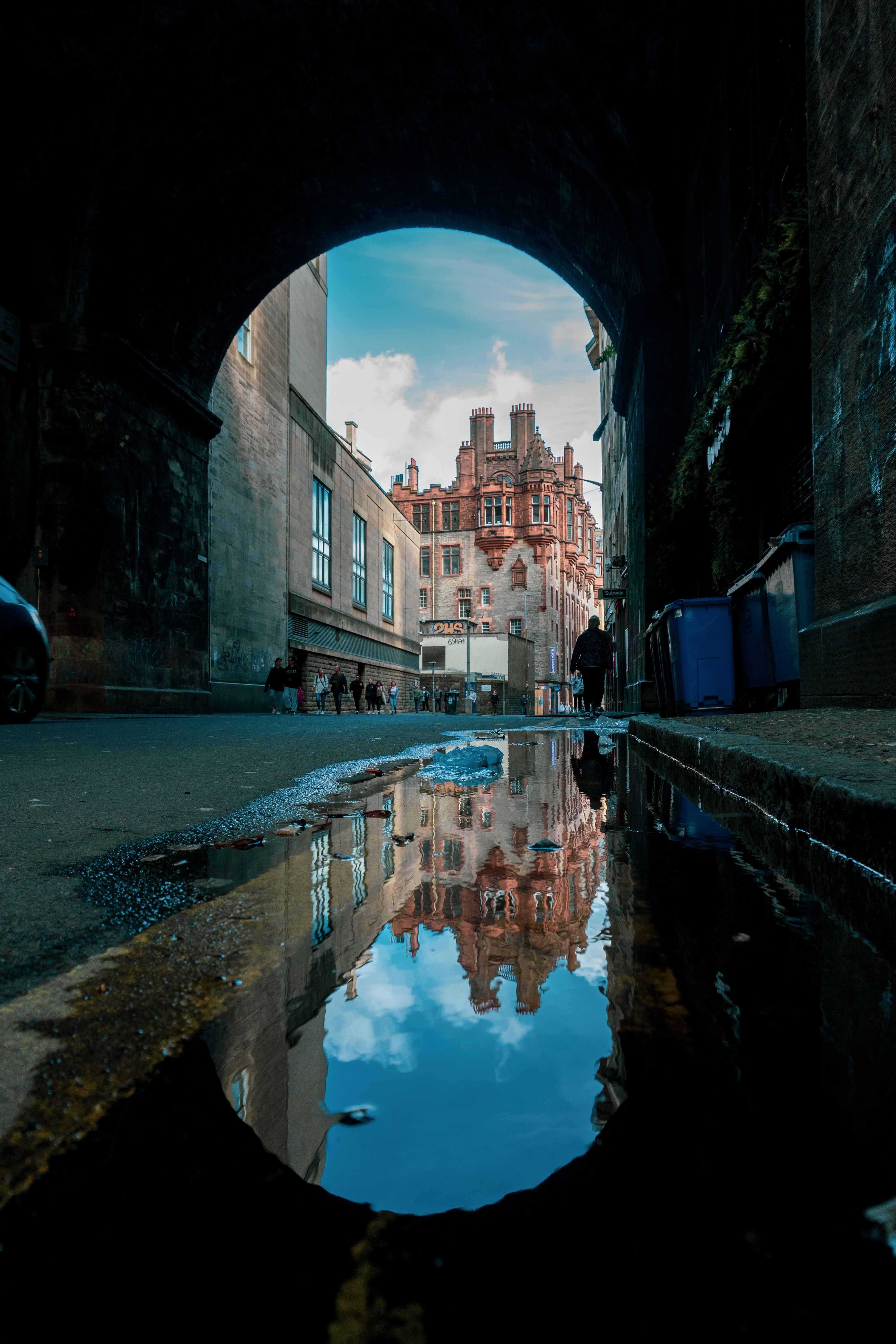 Reflection in Water Puddle in Tunnel · Free Stock Photo